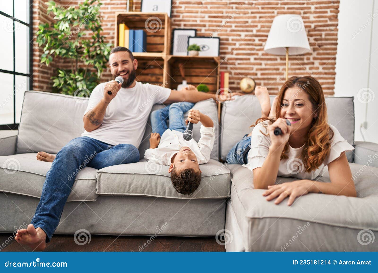 Family Singing Song Using Microphone at Home Stock Photo - Image of ...