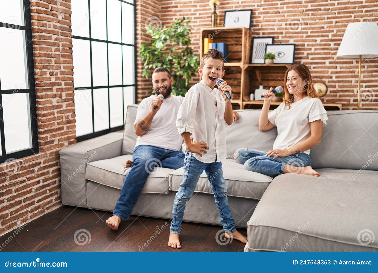Family Singing Song Using Microphone at Home Stock Image - Image of ...