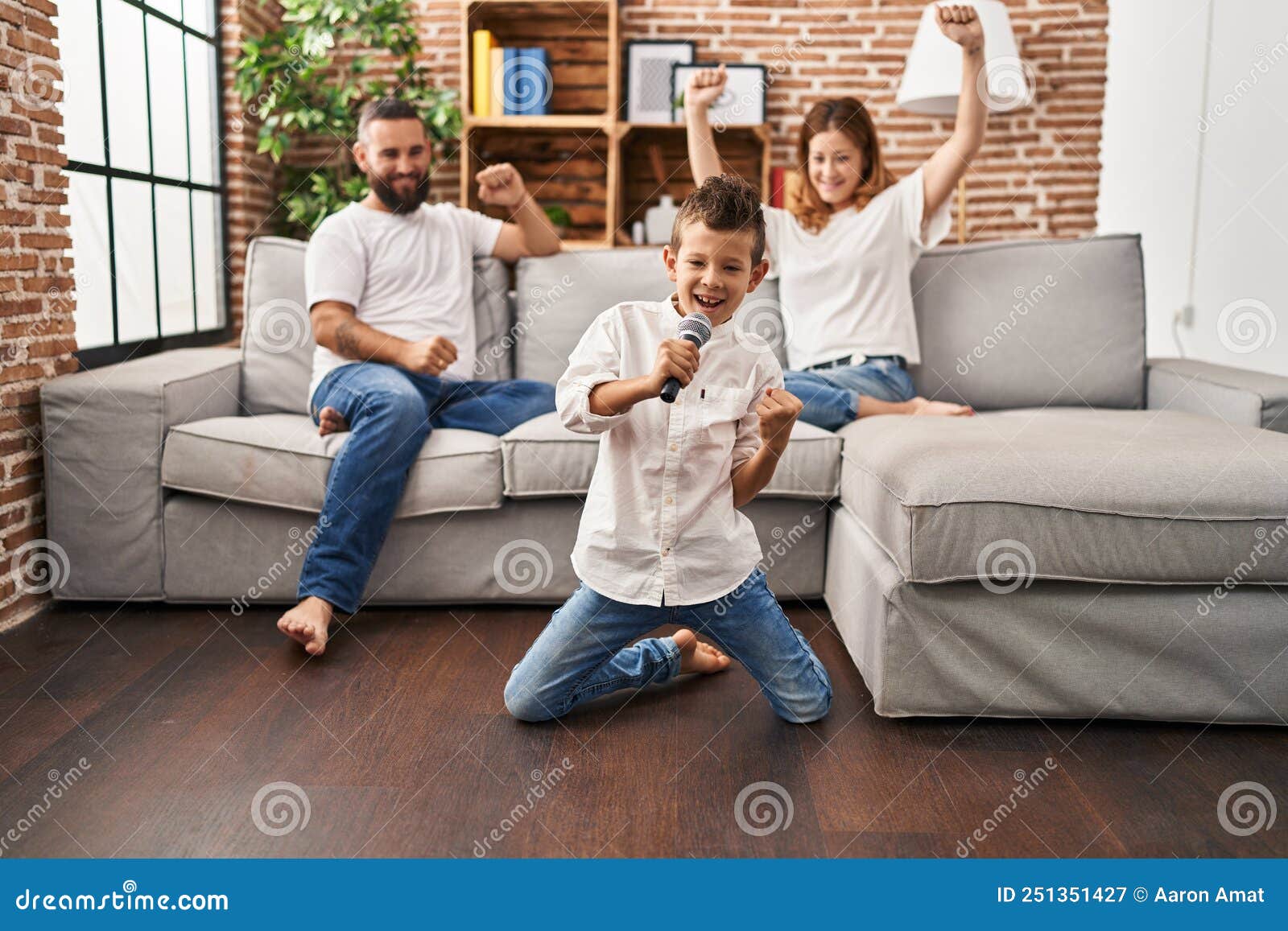 Family Singing Song Using Microphone at Home Stock Image - Image of ...