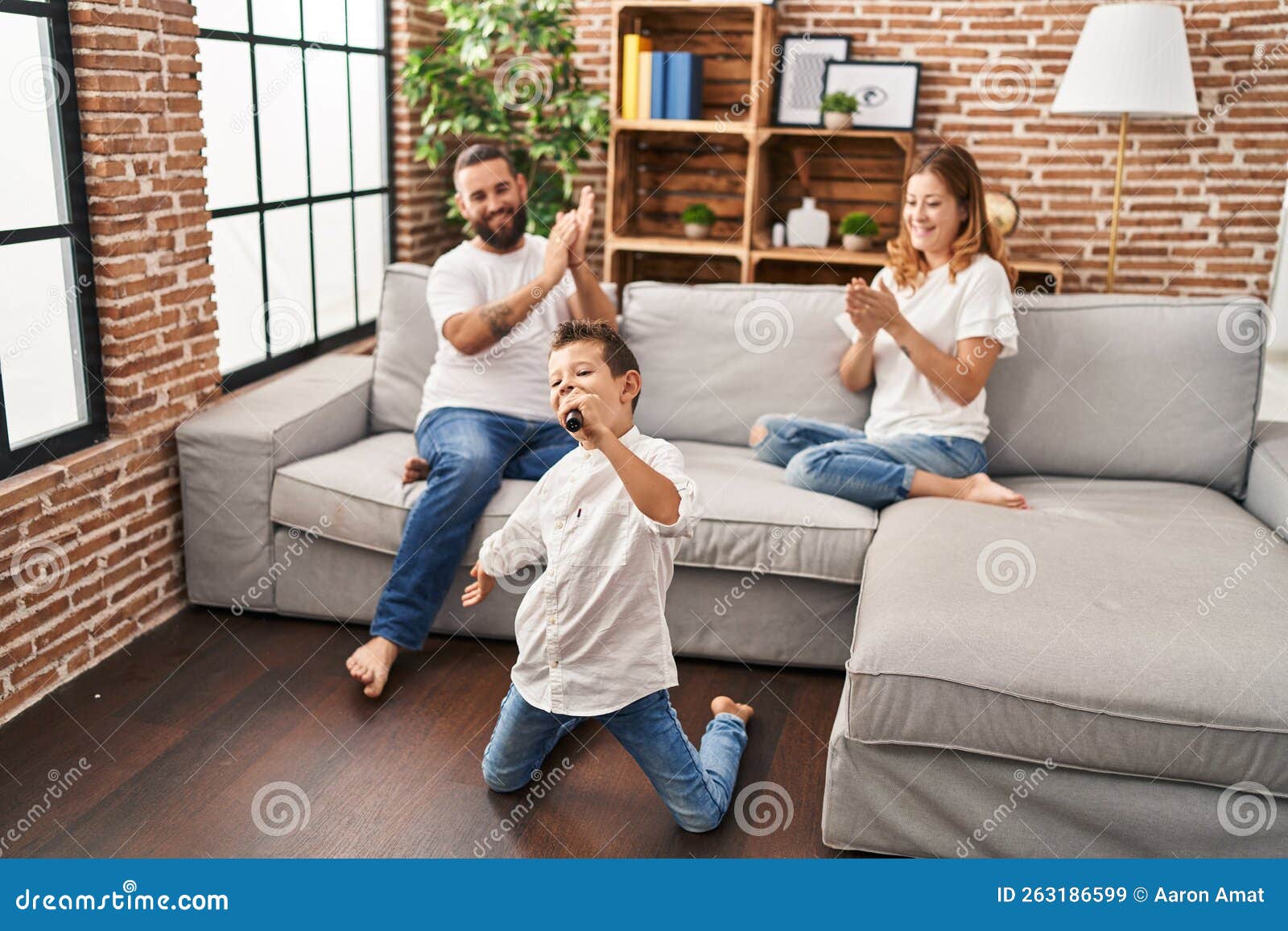 Family Singing Song Using Microphone at Home Stock Image - Image of ...