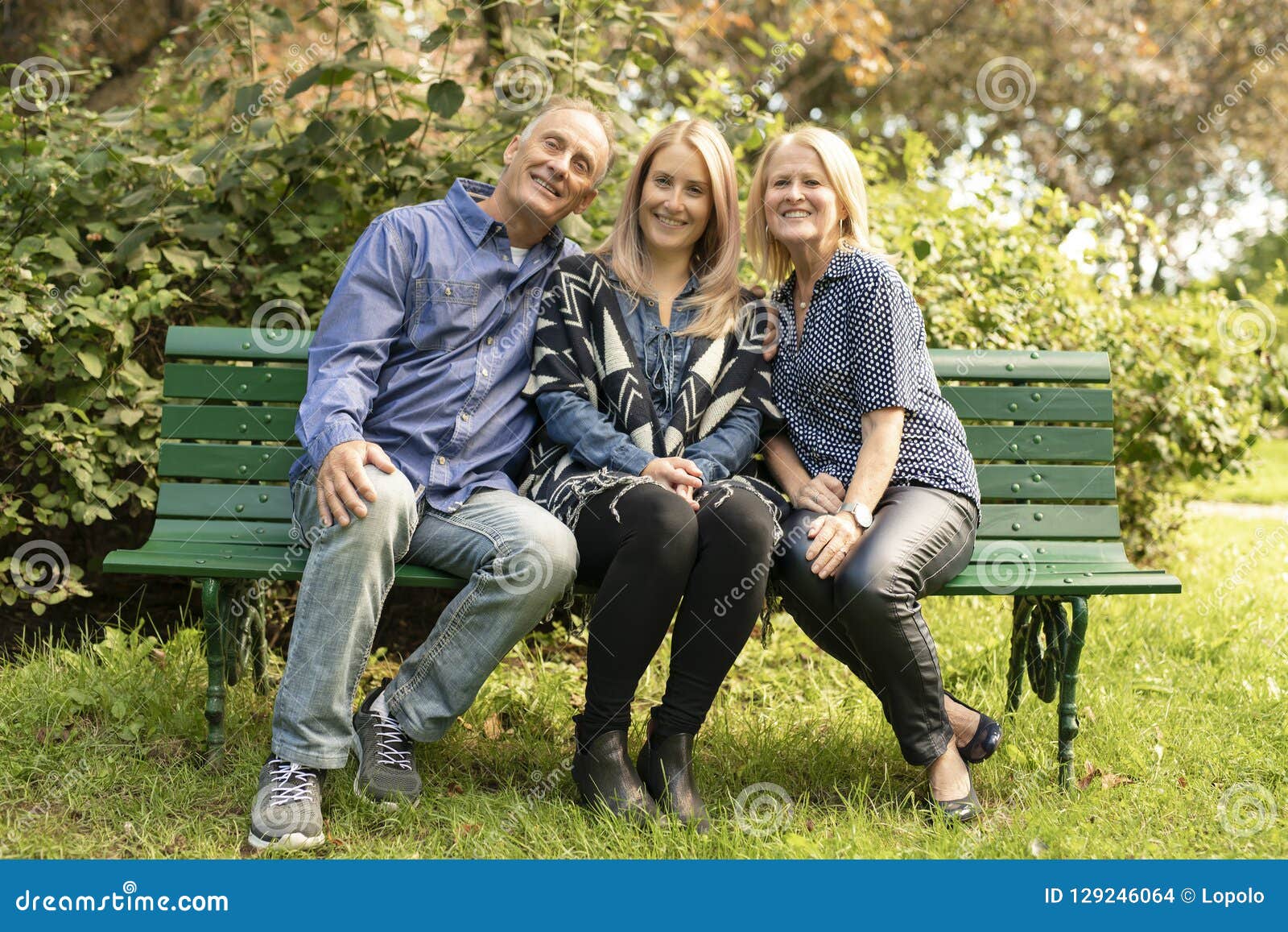 A Family Sit on Bench a Autumn Season Stock Photo - Image of father ...