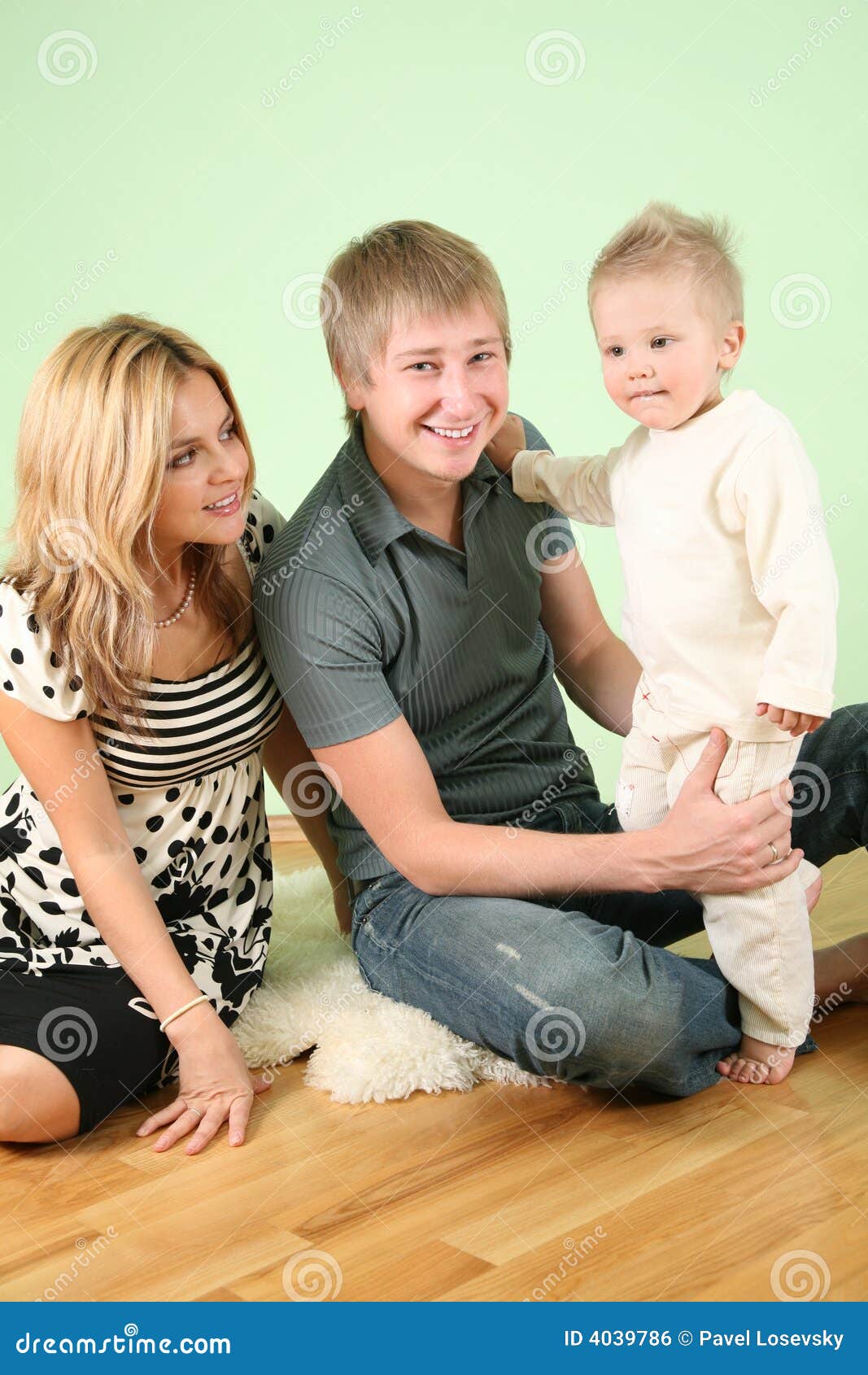 Family sit on fur carpet stock photo. Image of girls, blonde - 4039786