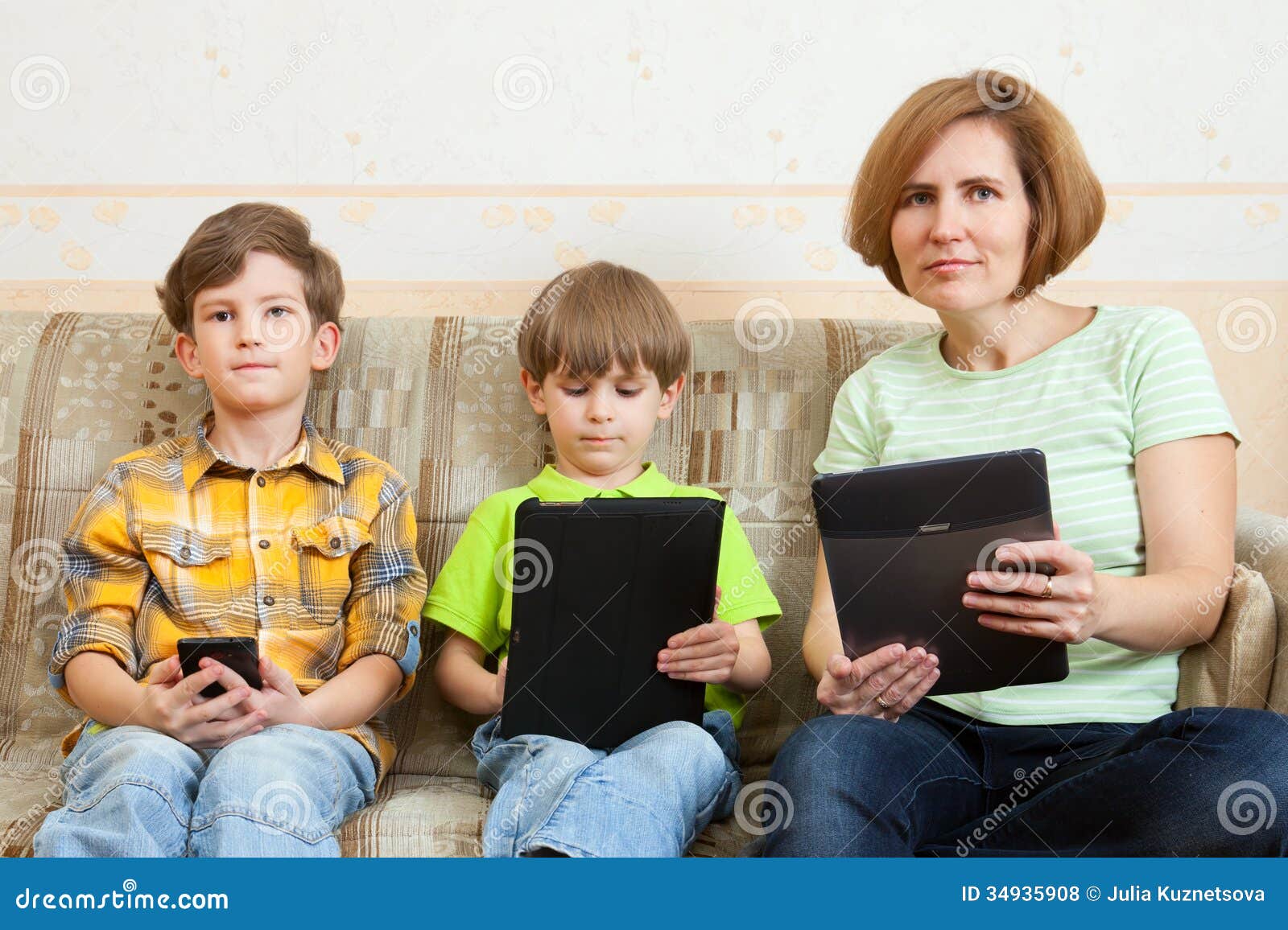The Family Sit with Gadgets Stock Photo - Image of kids, home: 34935908
