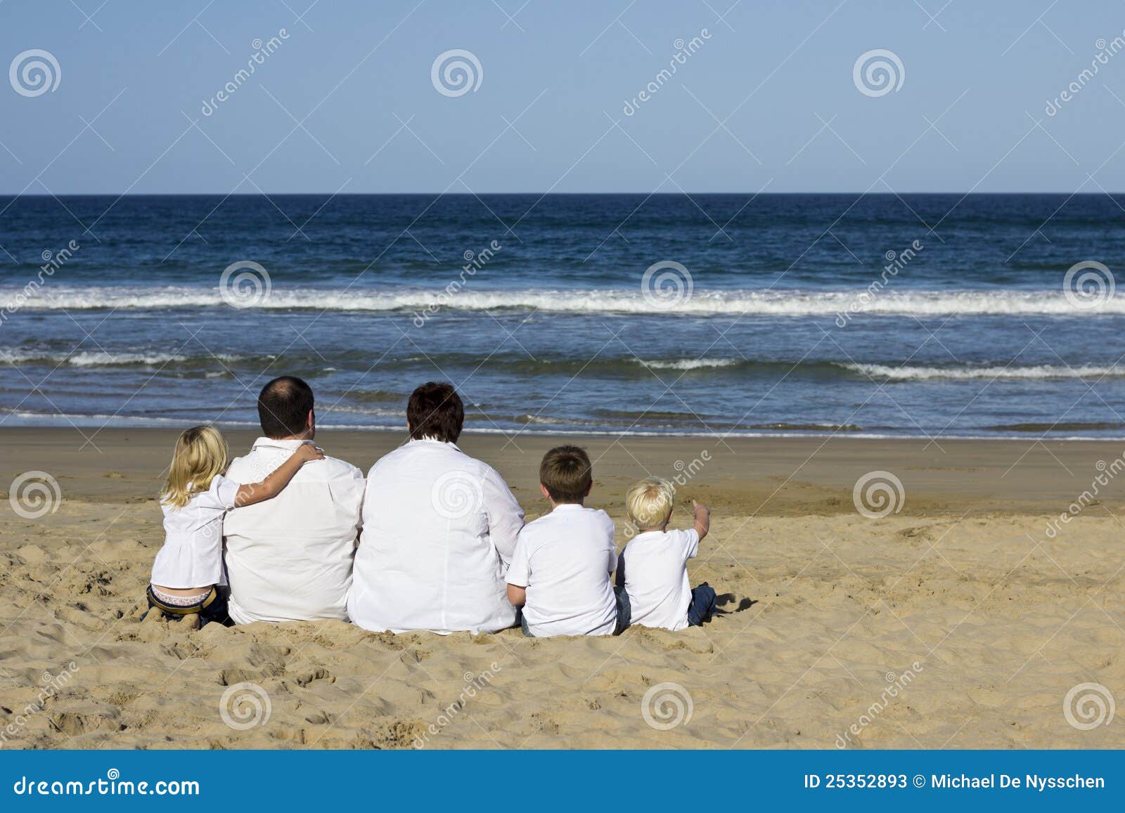 Family Sitting on Beach Watching Ocean Stock Image - Image of waves ...