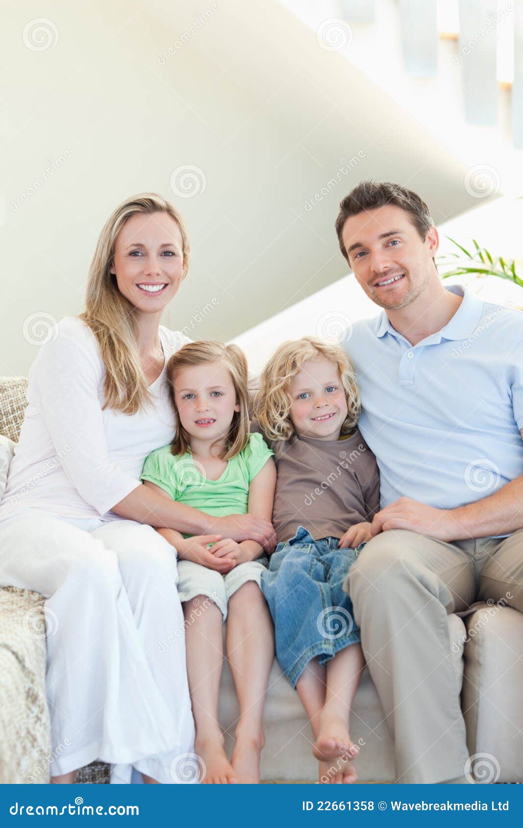 Family Sitting on the Couch Stock Photo - Image of happy, cheerful ...