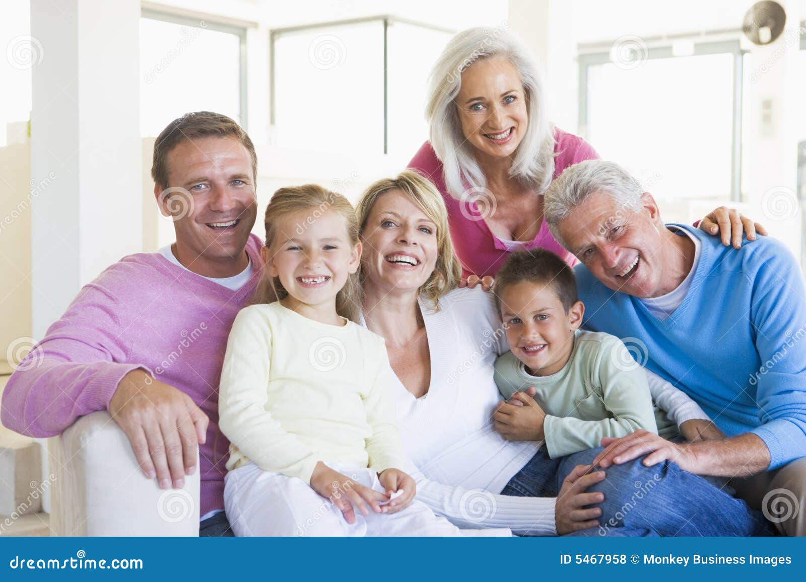 Family Sitting Indoors Smiling Stock Photo - Image of family, father ...
