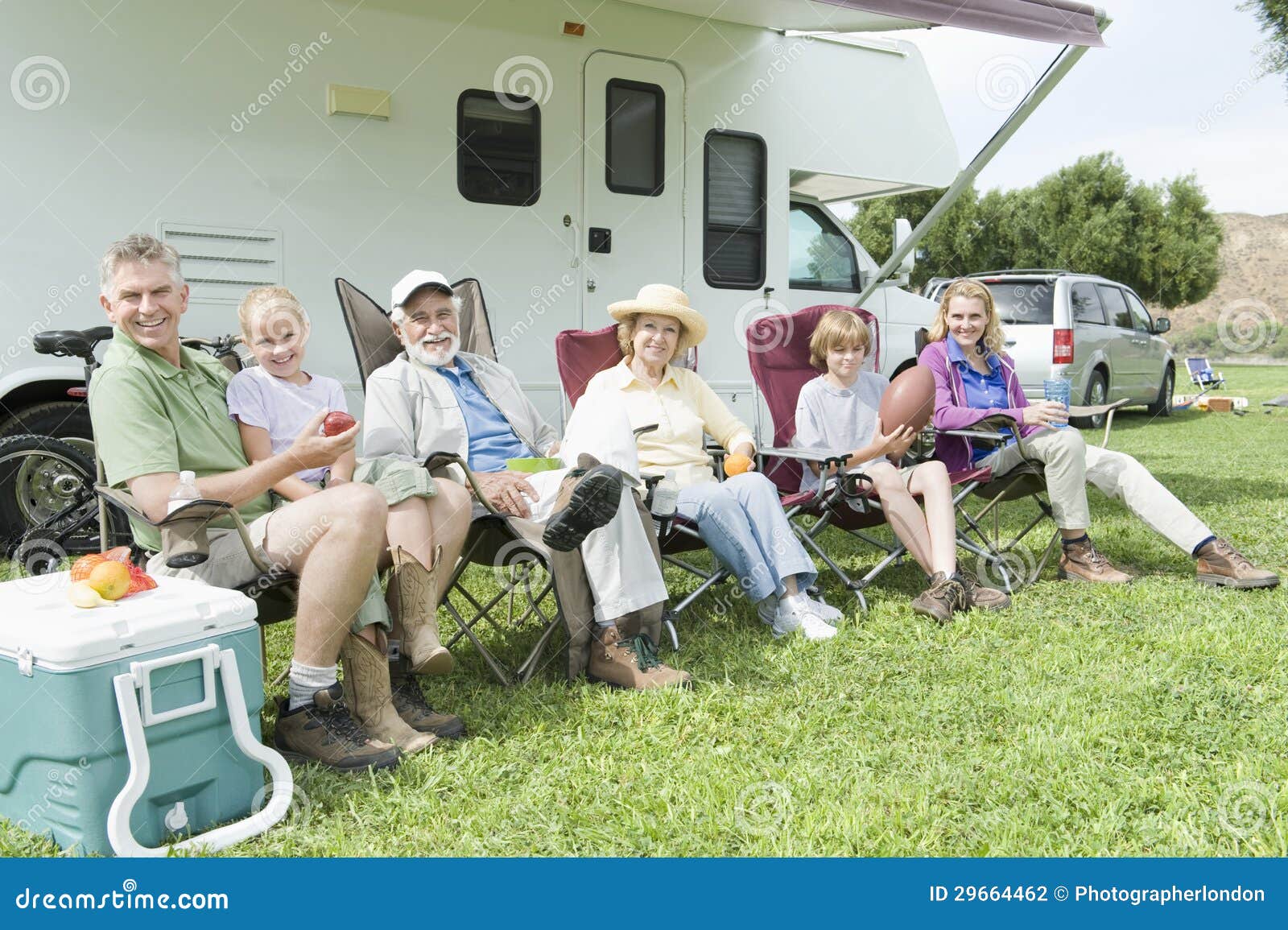 Family Sitting Outside RV Home Stock Photo - Image of group ...
