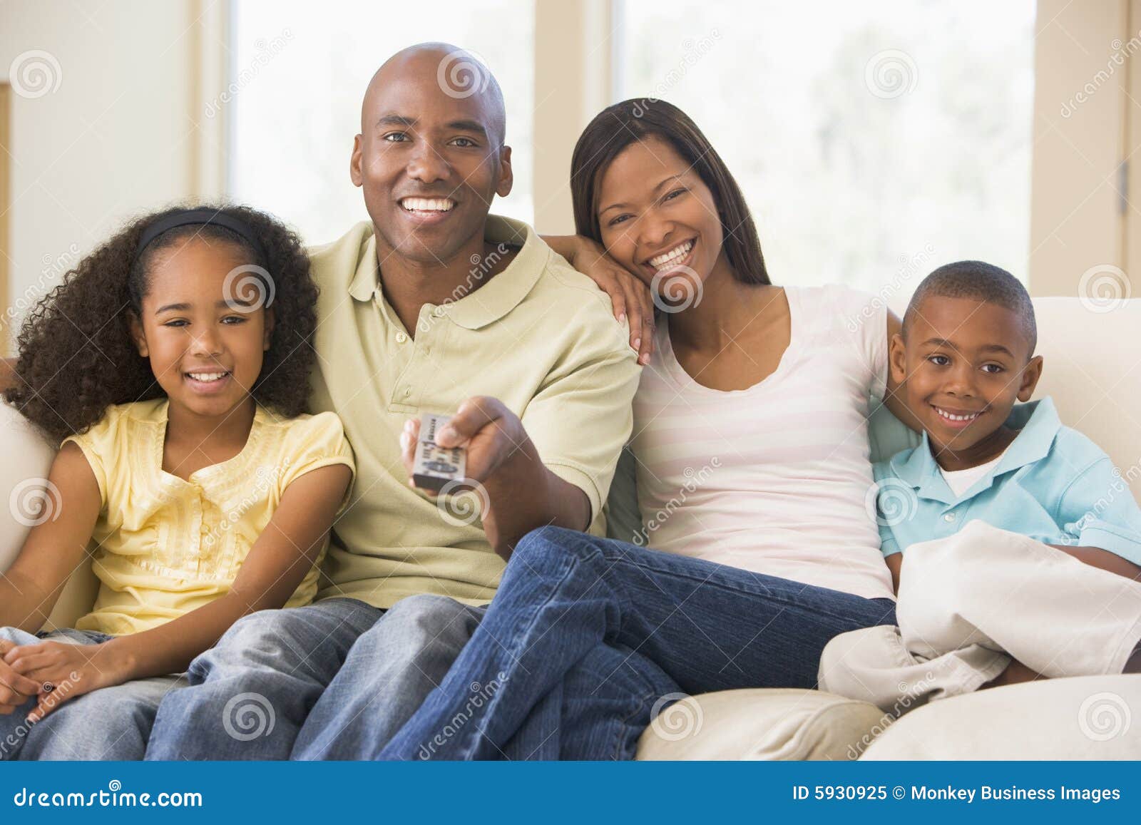 Family Sitting in Room with Remote Control Stock Image - Image of happy ...