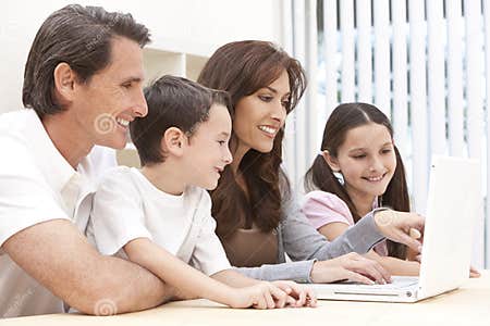 Family Sitting Using Laptop Computer at Home Stock Photo - Image of ...