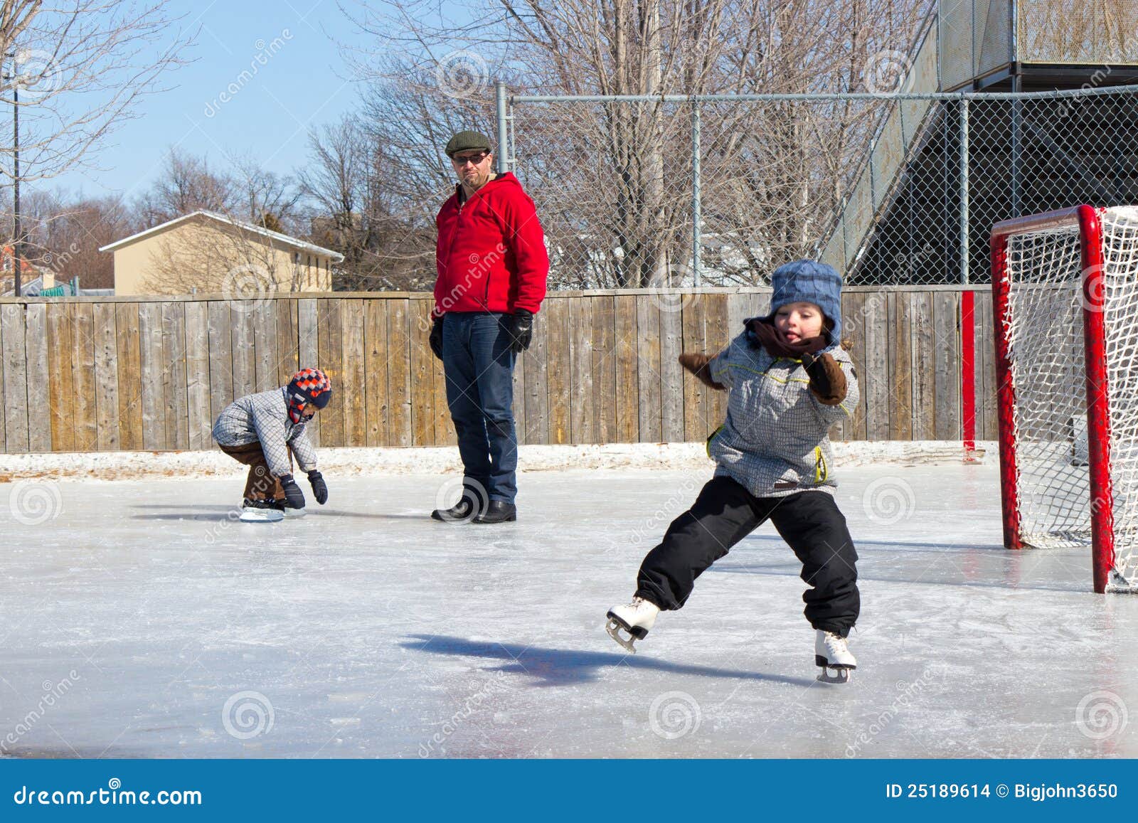 Family at a skating rink stock photo. Image of sister - 25189614