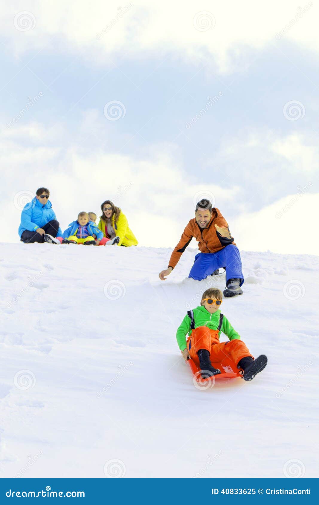 Family Sledding in Winter in Mountain Stock Image - Image of expression ...