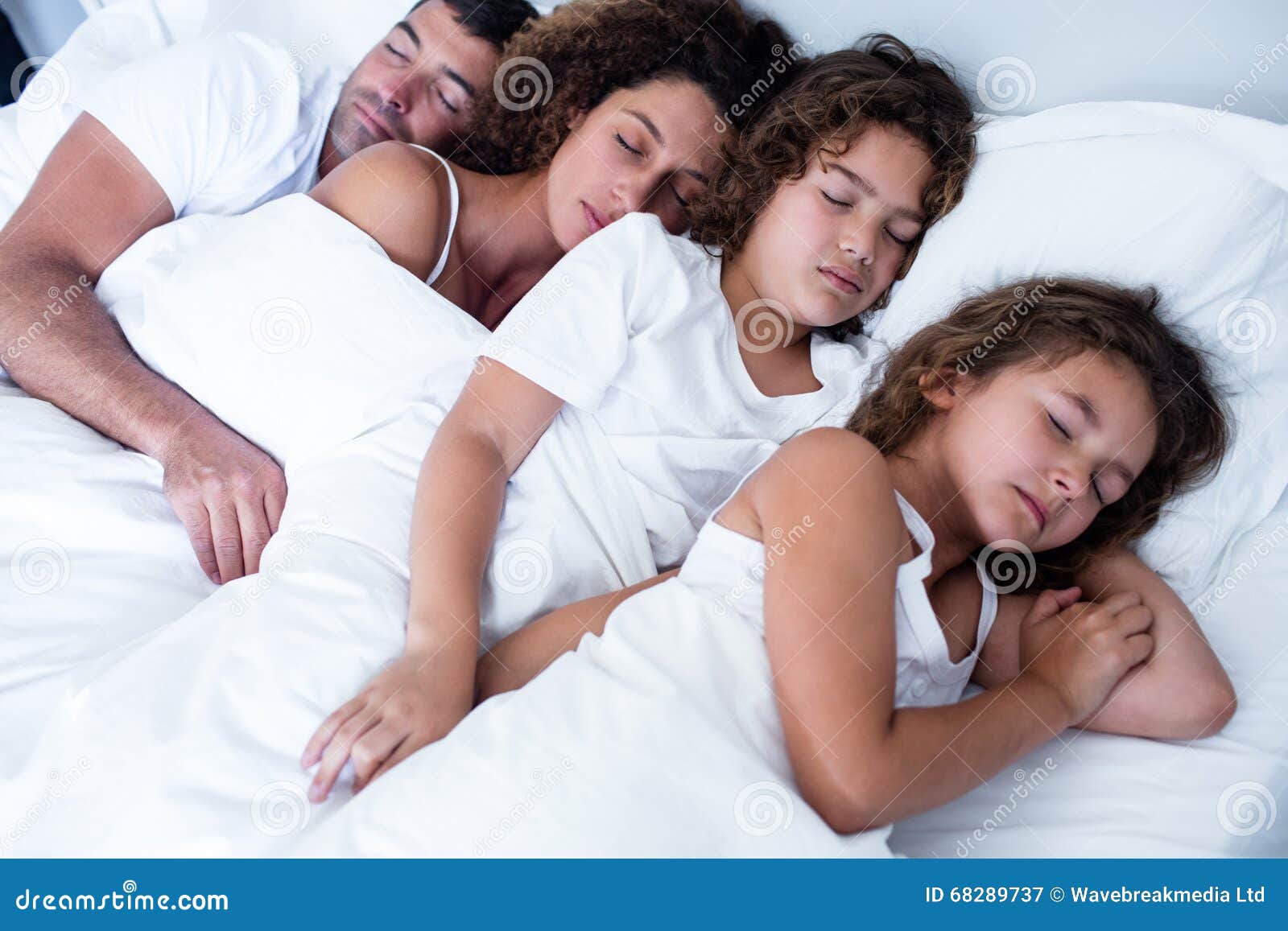 Family Sleeping Together on Bed Stock Image - Image of family, home ...