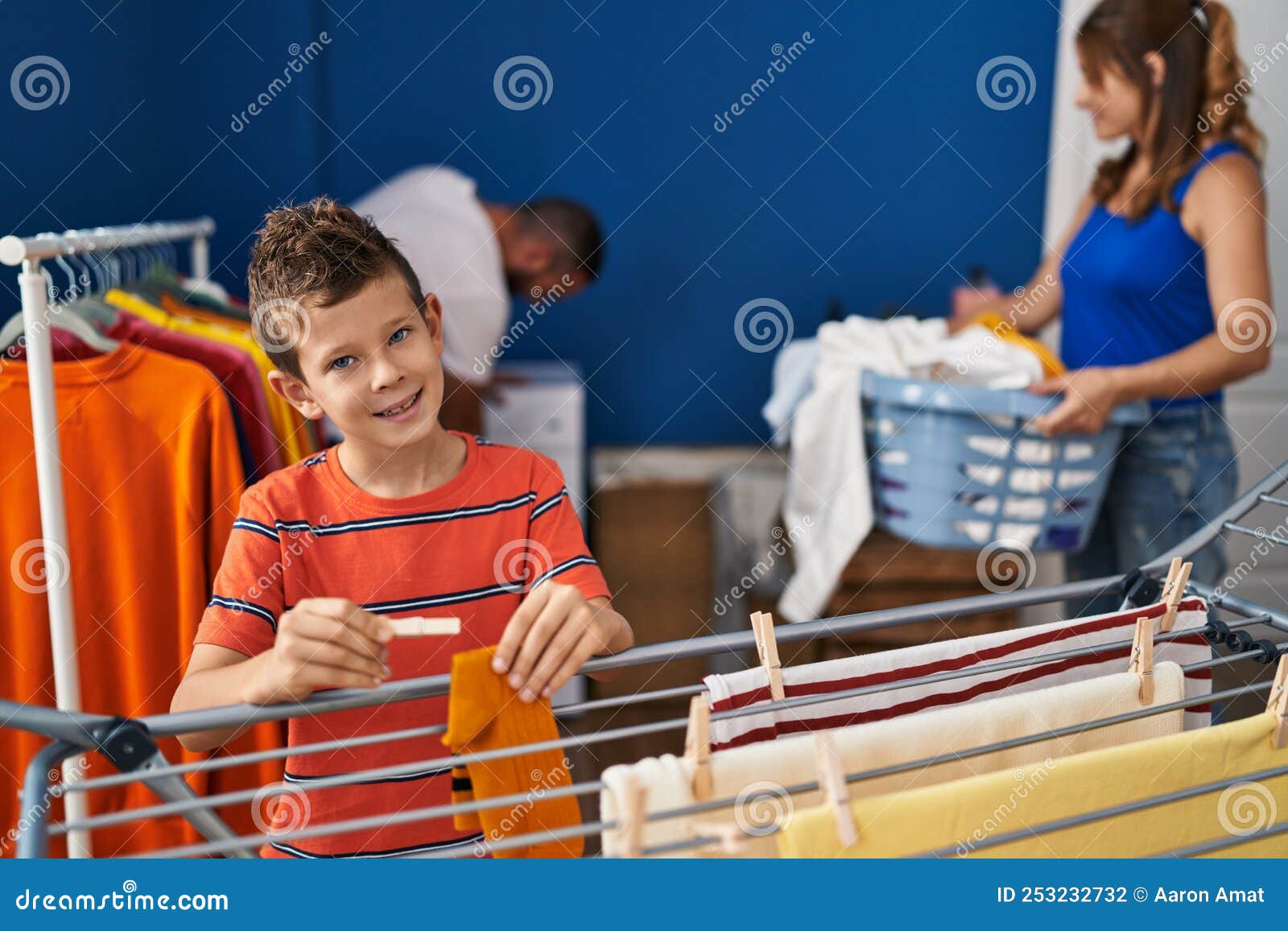 Family Smiling Confident Doing Laundry at Laundry Room Stock Photo ...