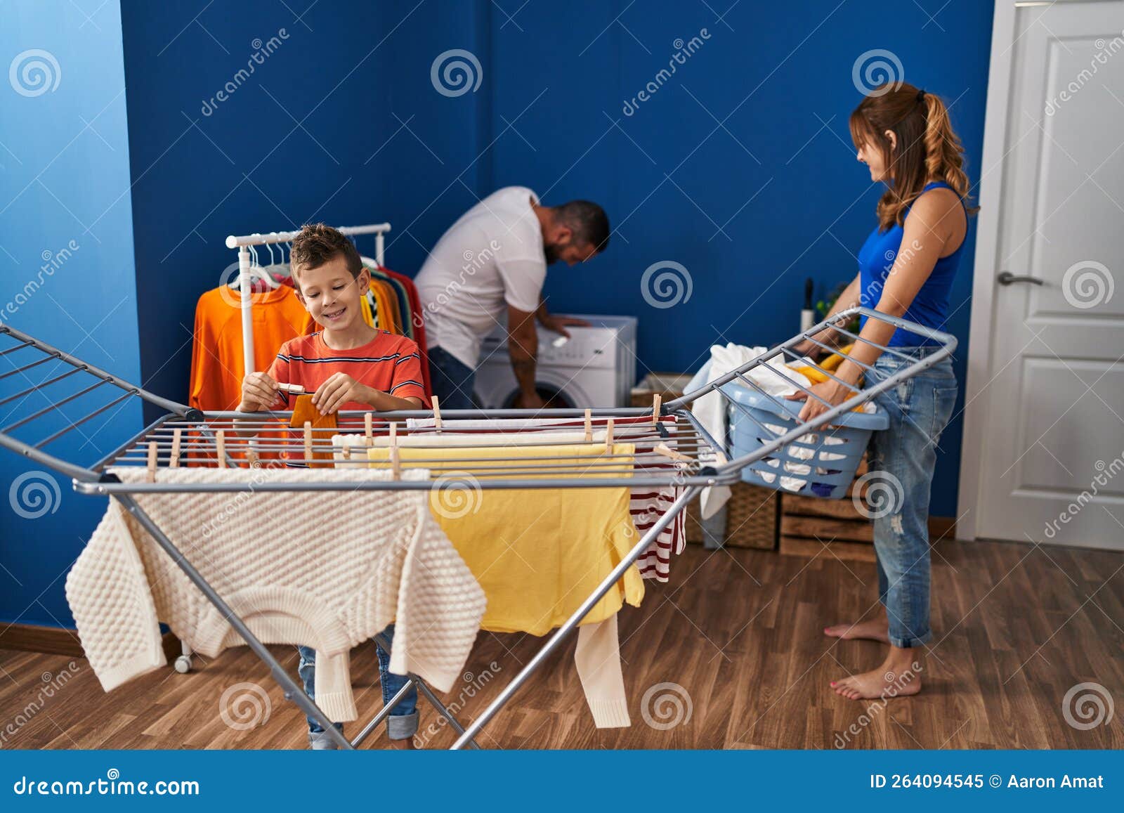 Family Smiling Confident Doing Laundry at Laundry Room Stock Image ...