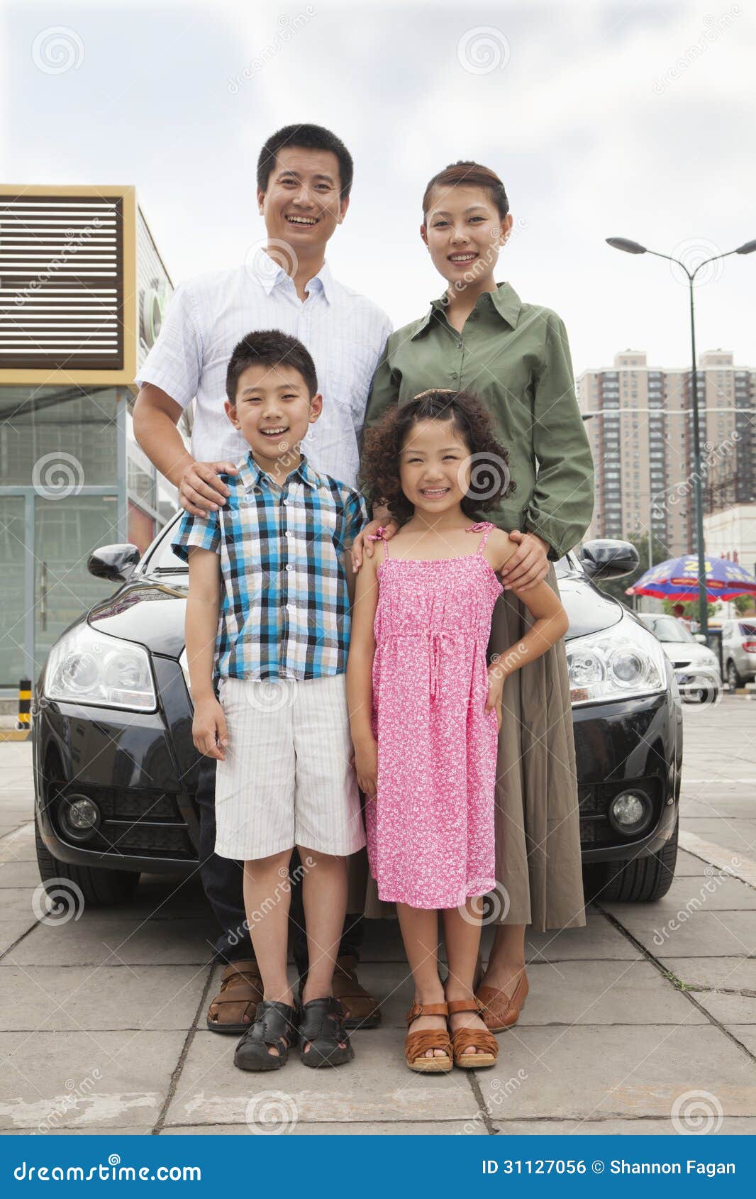 Family Smiling and Standing in Front of the Car, Portrait Stock Photo ...