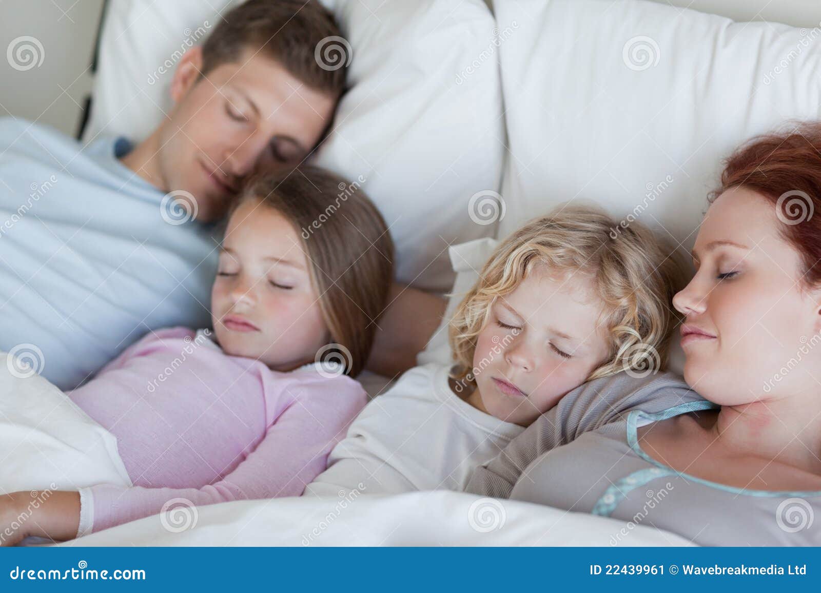 Family snoozing together stock image. Image of dream - 22439961