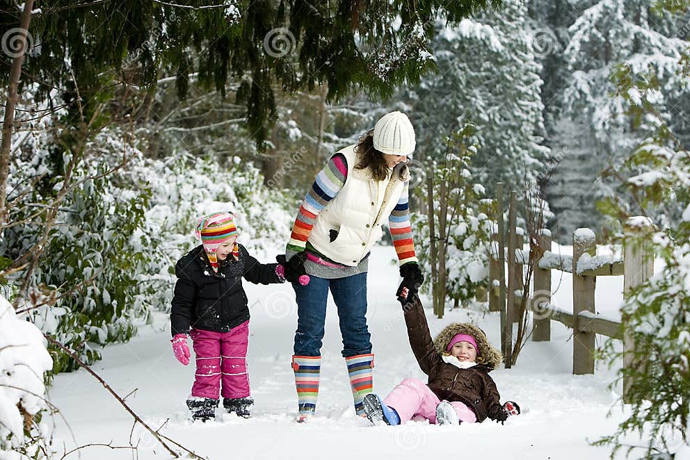 Family in snow stock image. Image of play, slip, silly - 18790909