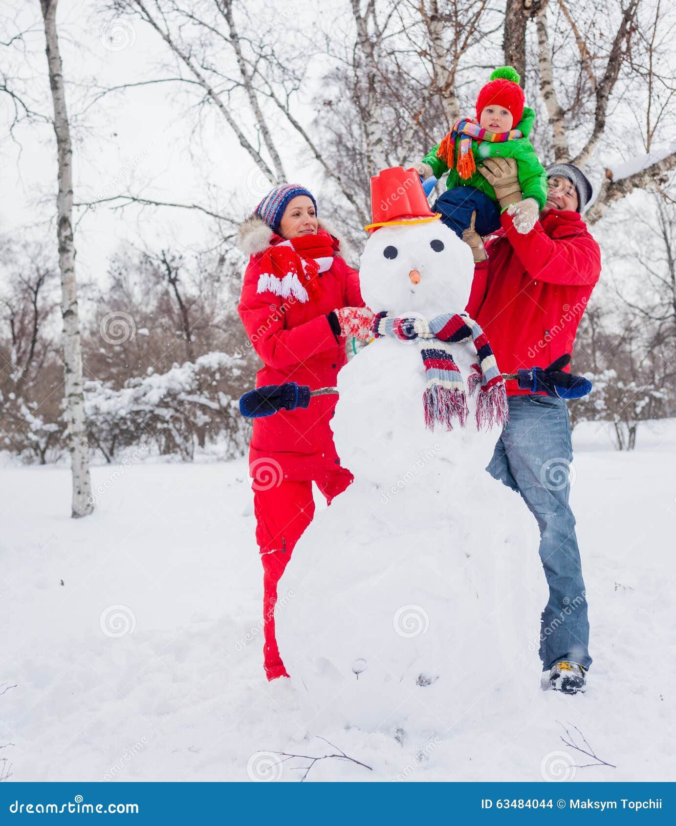 Family with a snowman stock photo. Image of little, color - 63484044