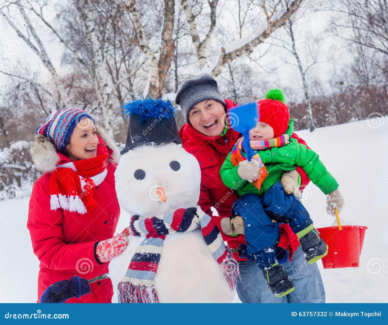 Family with a snowman stock photo. Image of holiday, clothing - 63757332