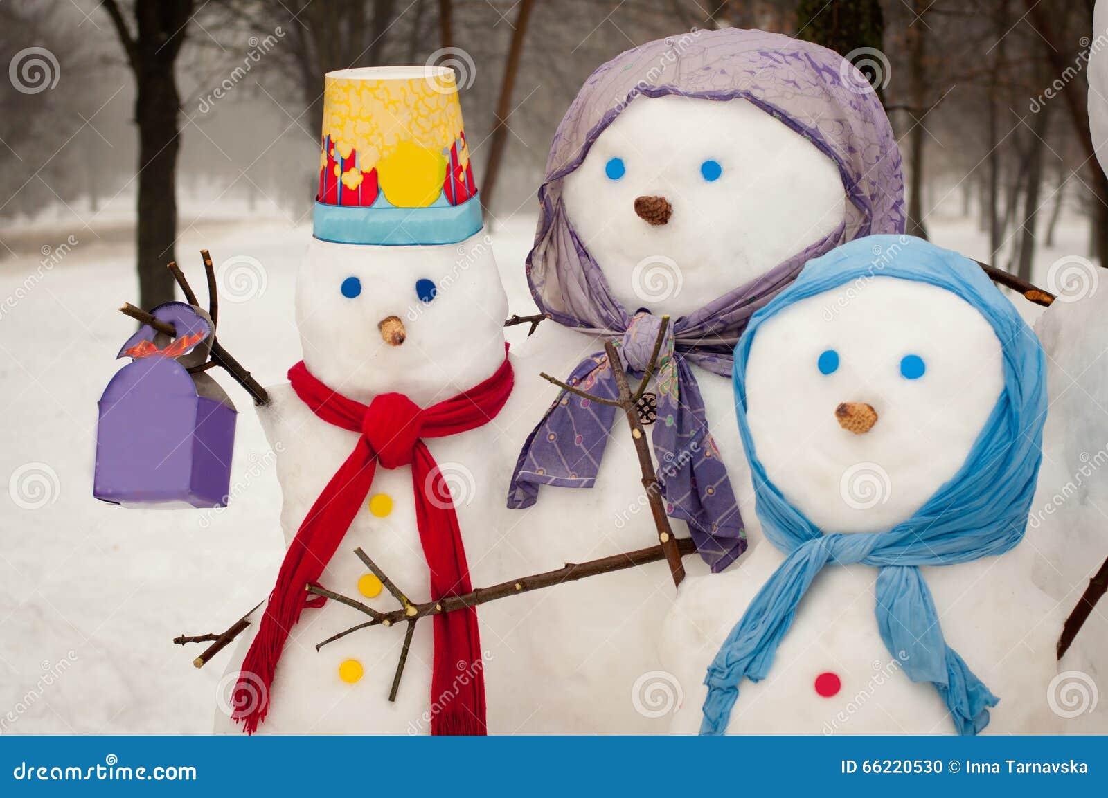 Family of snowmen outdoors stock photo. Image of snowman - 66220530