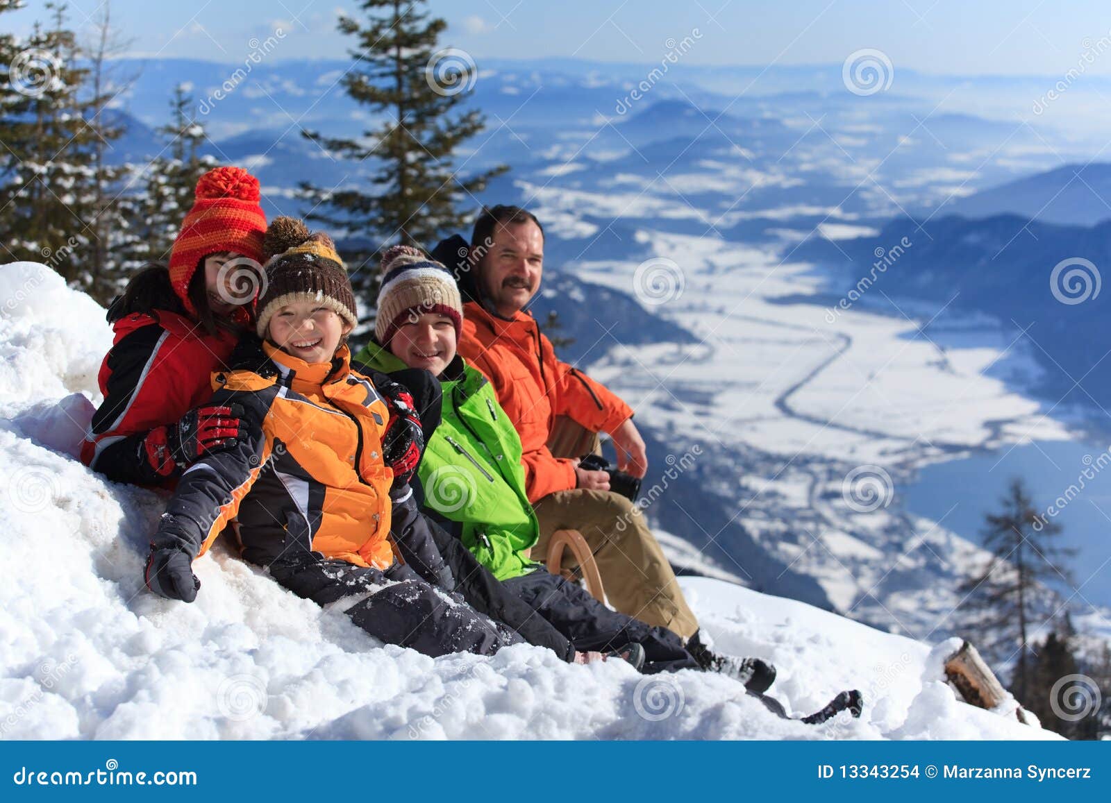 Family on snowy mountain stock photo. Image of clothes - 13343254