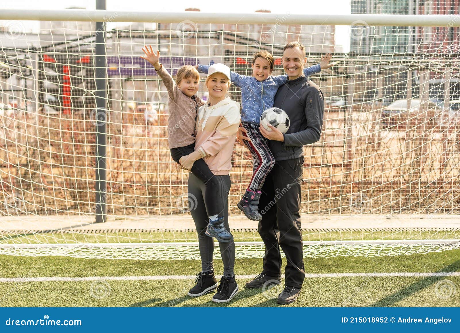 Family with Soccer Ball in Stadium Stock Photo - Image of parent, value ...