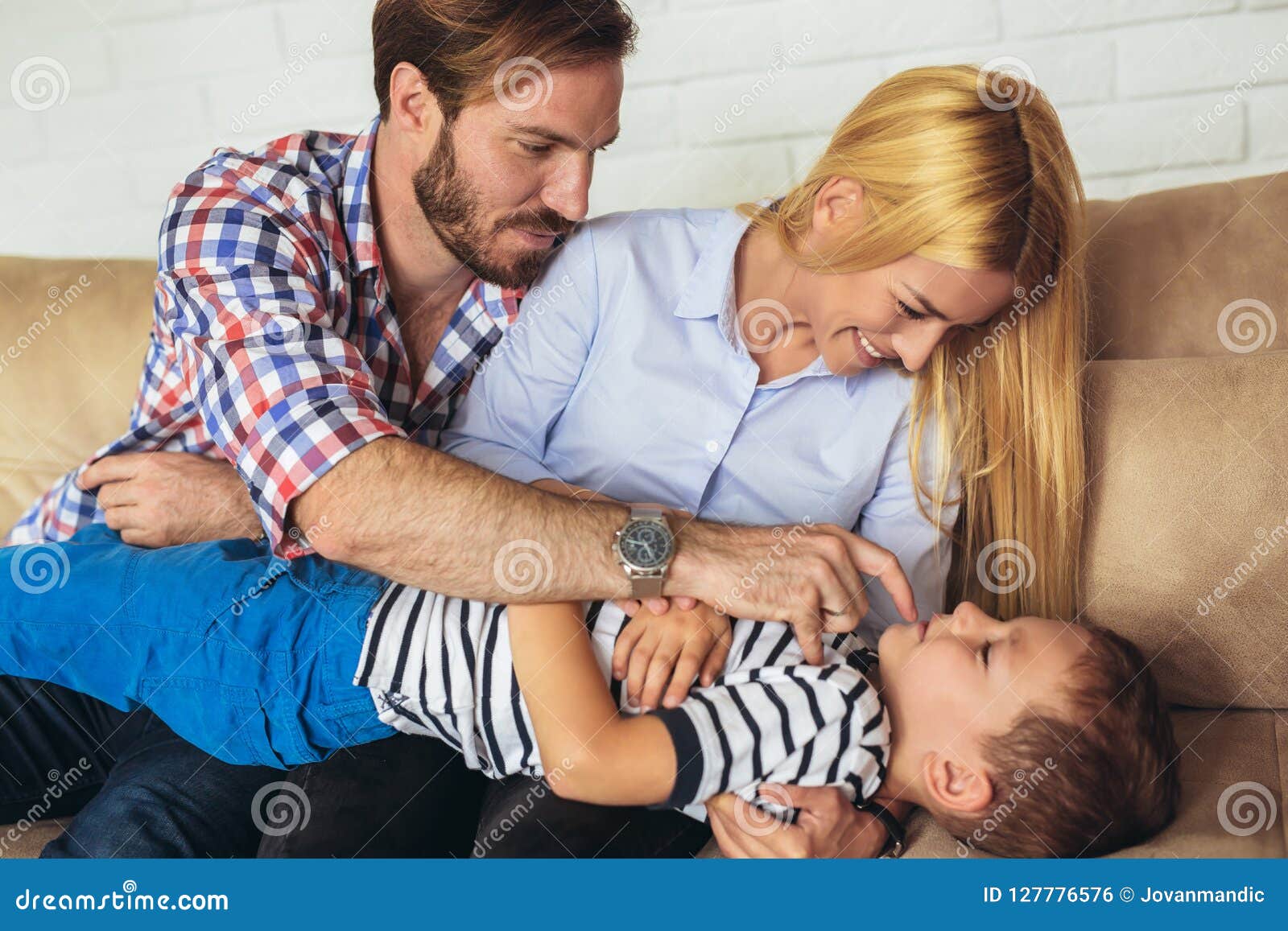 Family Spending Time at Home with Their Son Stock Photo - Image of love ...