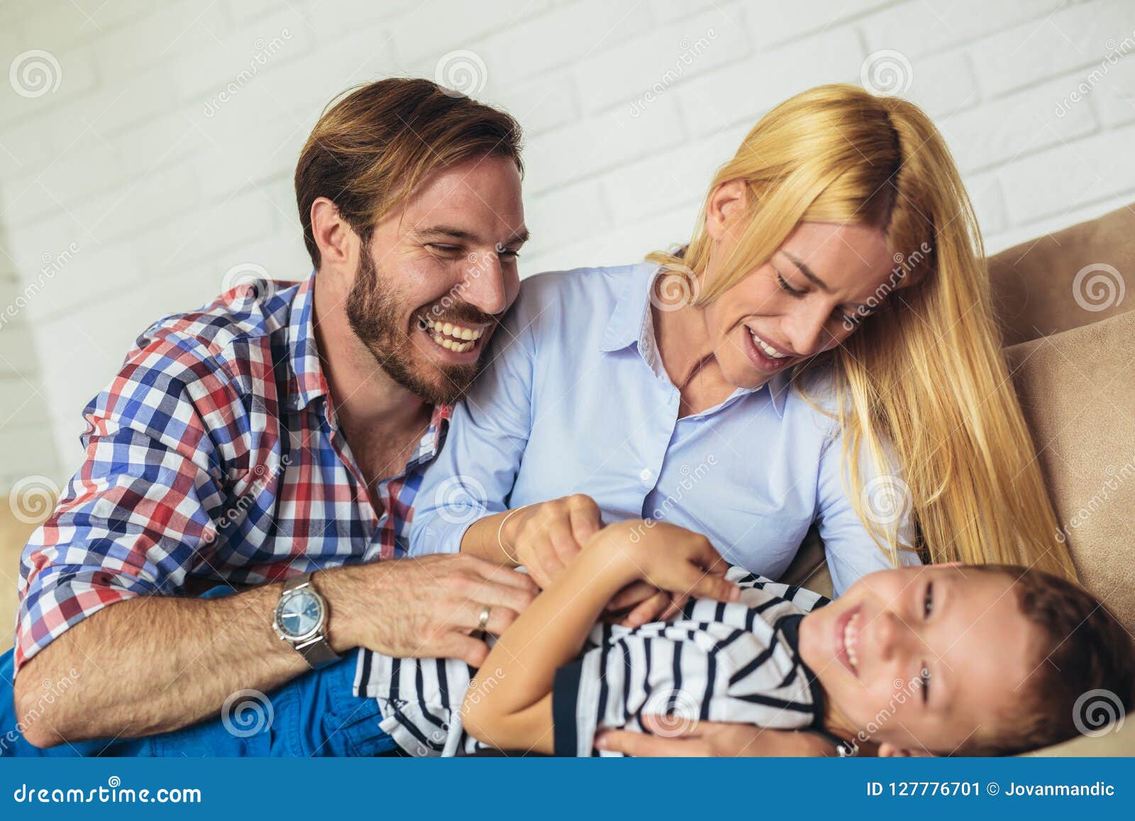 Family Spending Time at Home with Their Son Stock Image - Image of ...