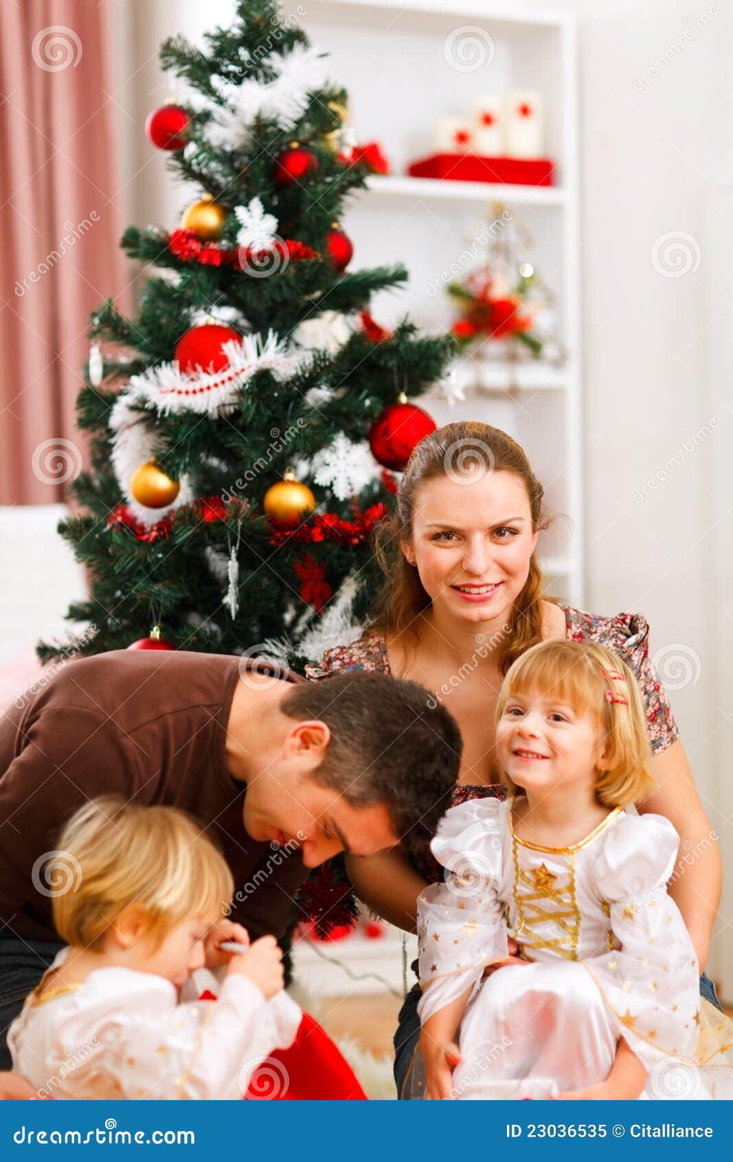 Family Spending Time Near Christmas Tree Stock Image - Image of ...