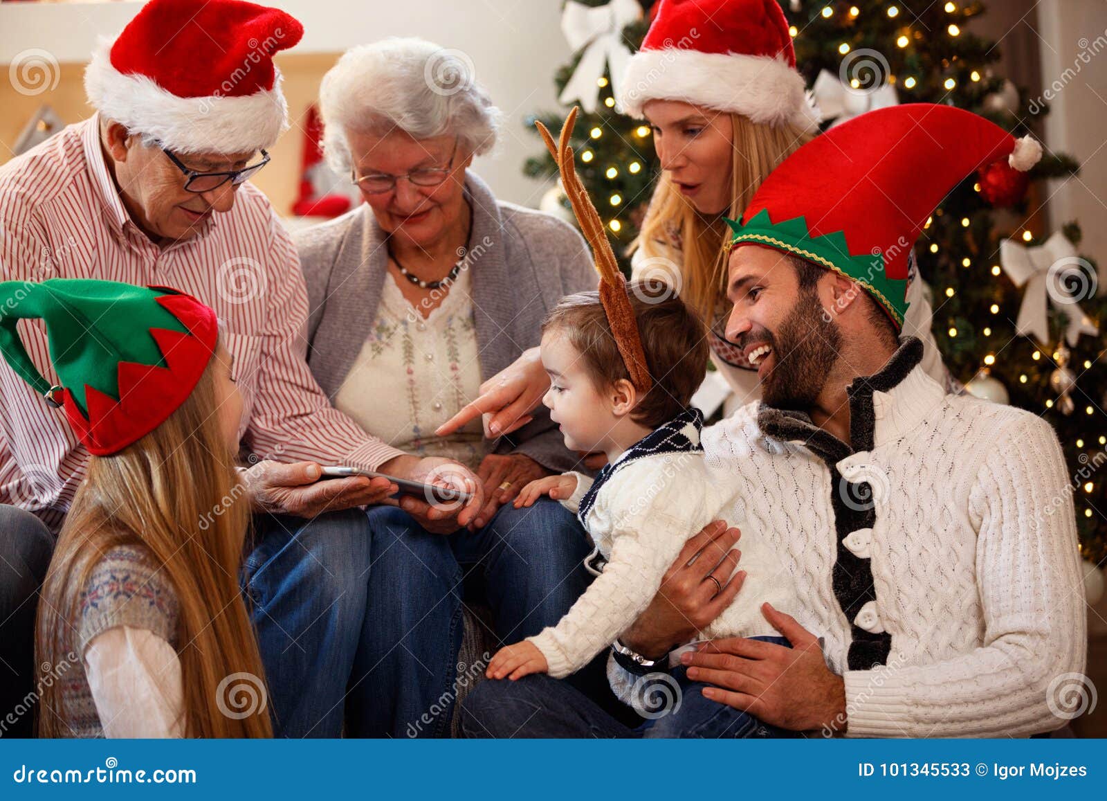 Family is Spending Time Together on Christmas Day and Using Tablet ... Family is Spending Time Together on Christmas Day and Using Tablet ...
