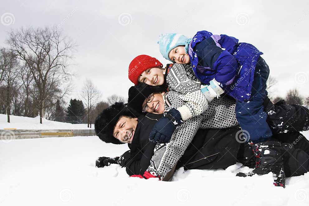 Family stacked in snow. stock photo. Image of enjoyment - 3531260