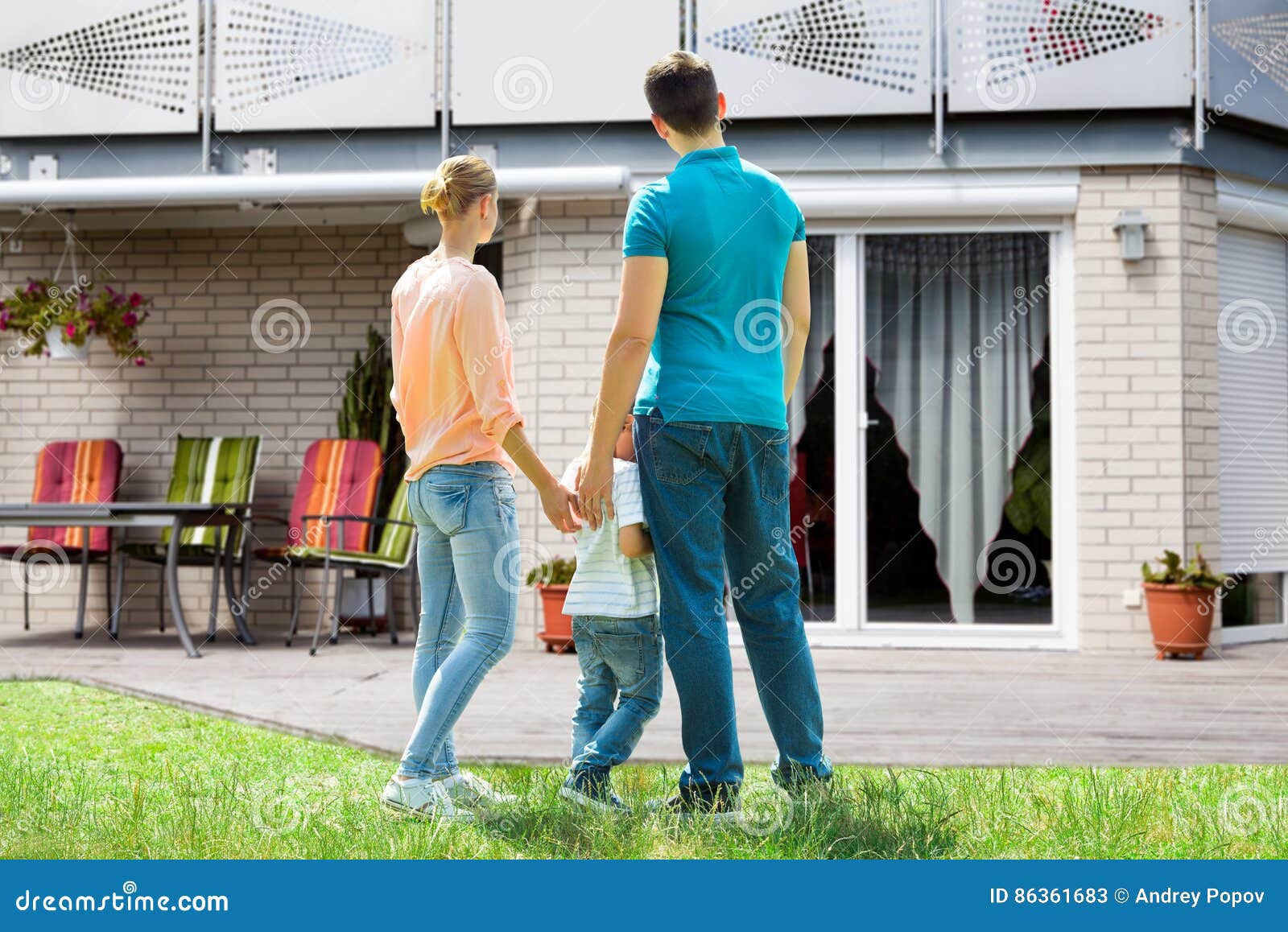 Family Standing in Front of Their House Stock Image - Image of ...