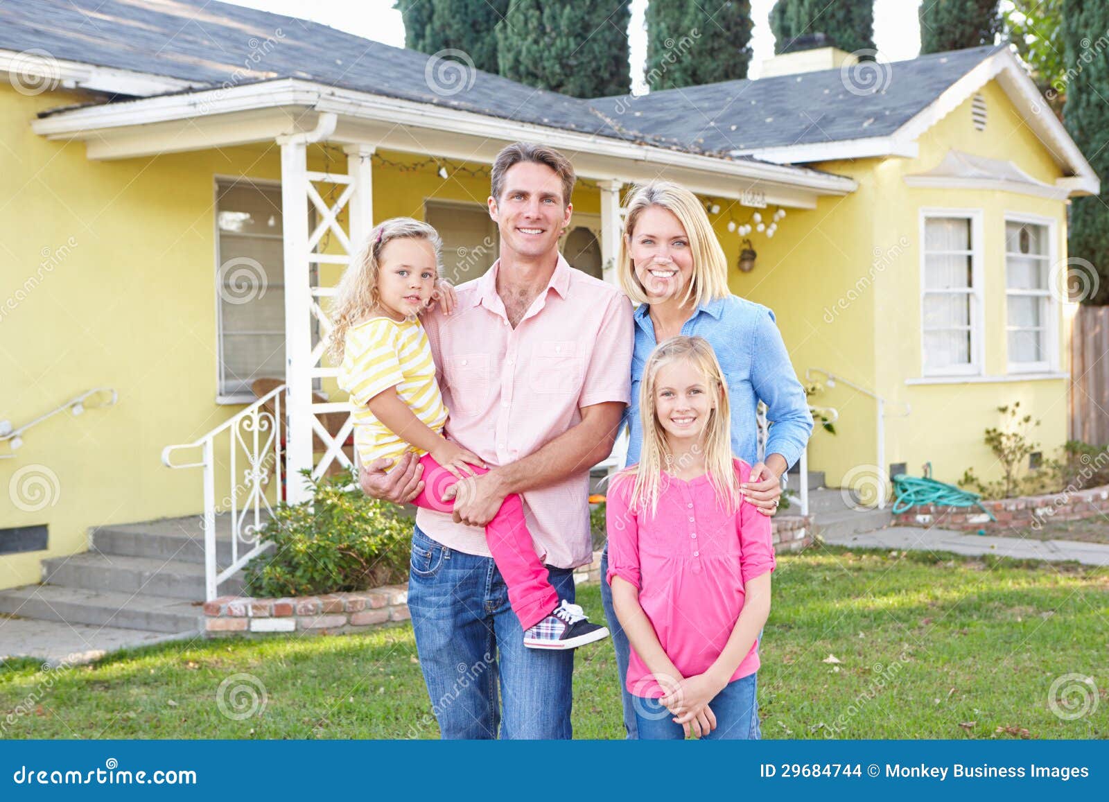 Family Standing Outside Suburban Home Stock Photo - Image of girl ...