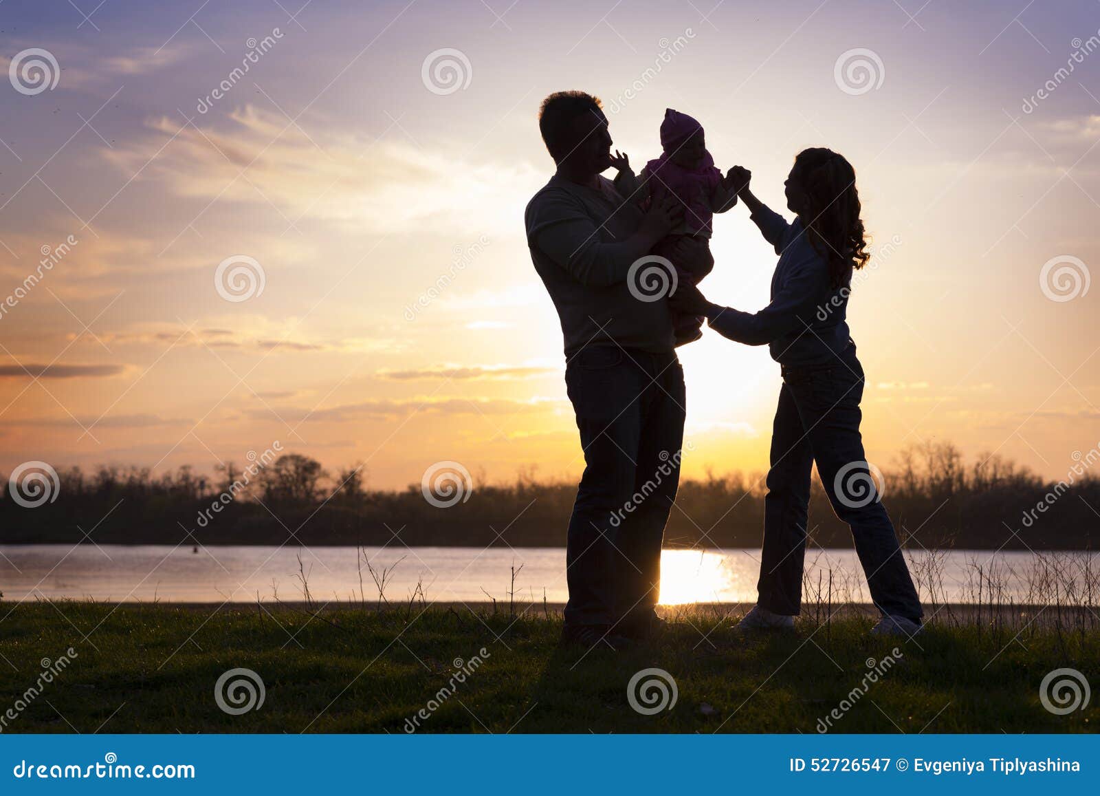 Family at sunset stock image. Image of couple, family - 52726547