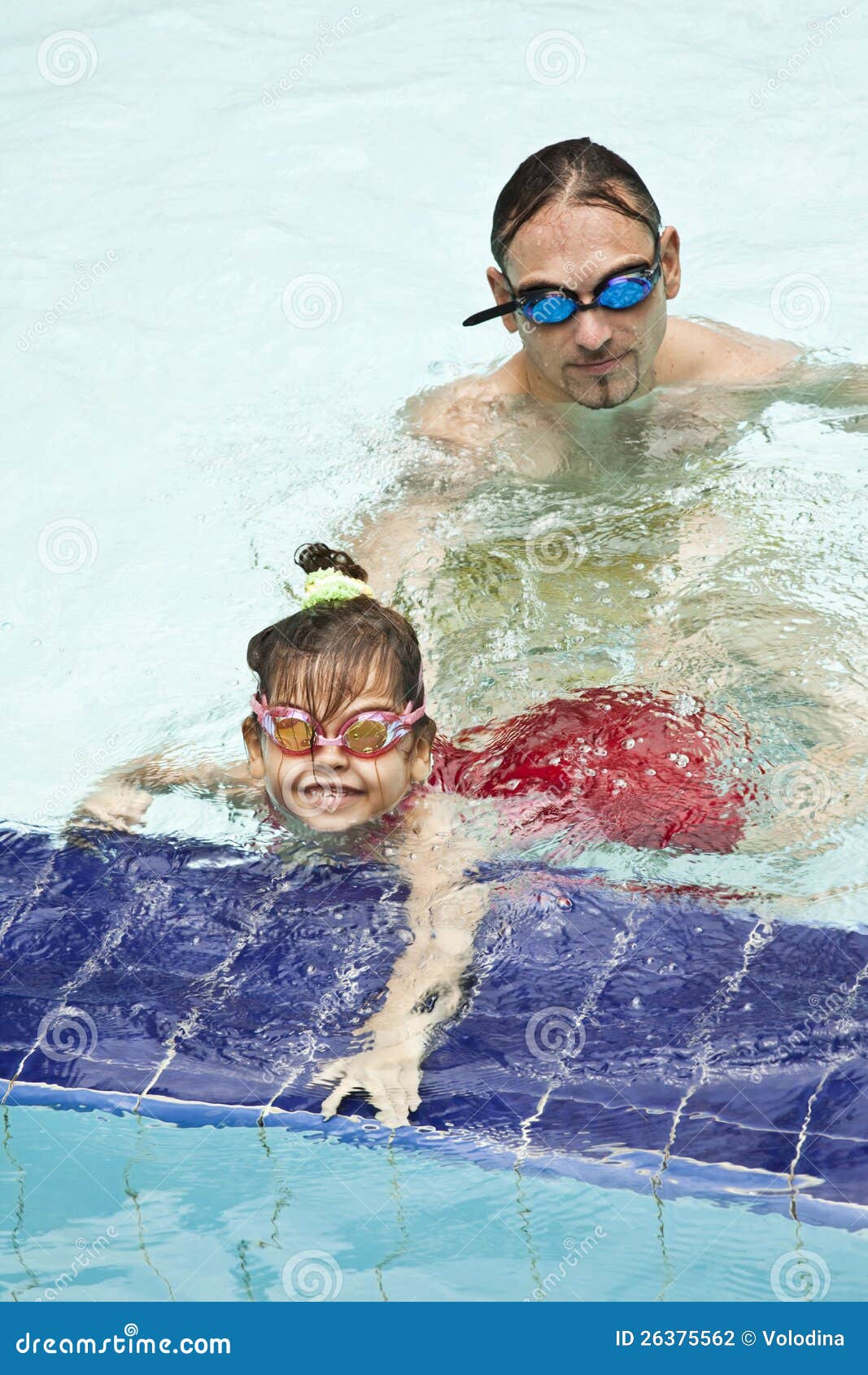 Family in swimming pool stock photo. Image of blue, child - 26375562