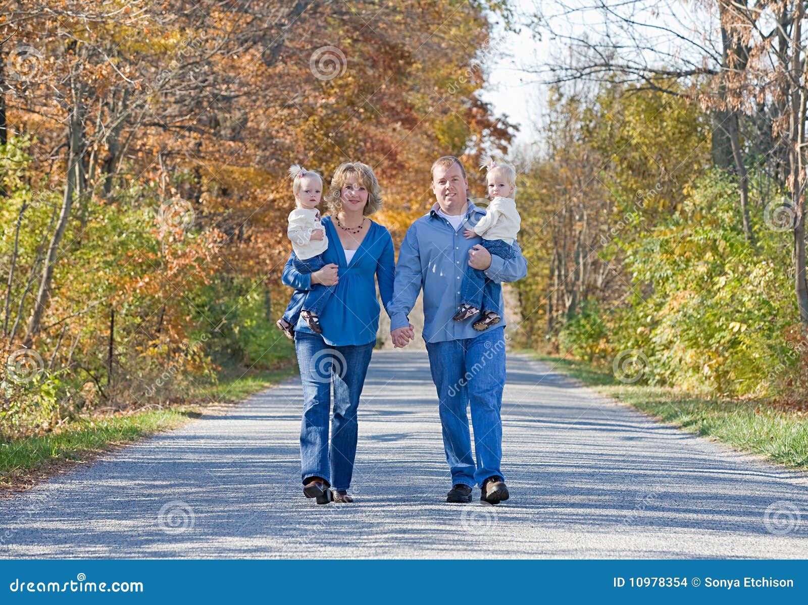 Family Taking a Walk stock photo. Image of cheerful, autumn - 10978354