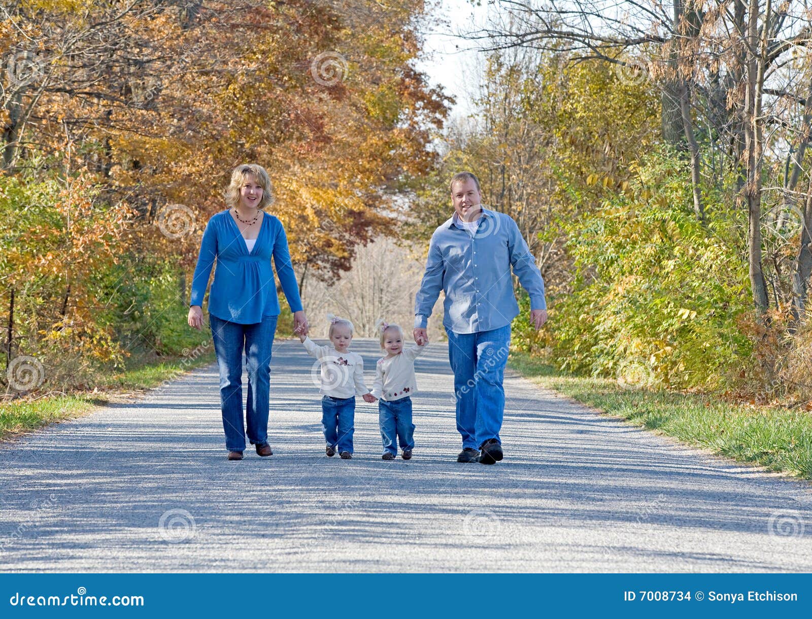 Family Taking a Walk stock photo. Image of holding, girls - 7008734