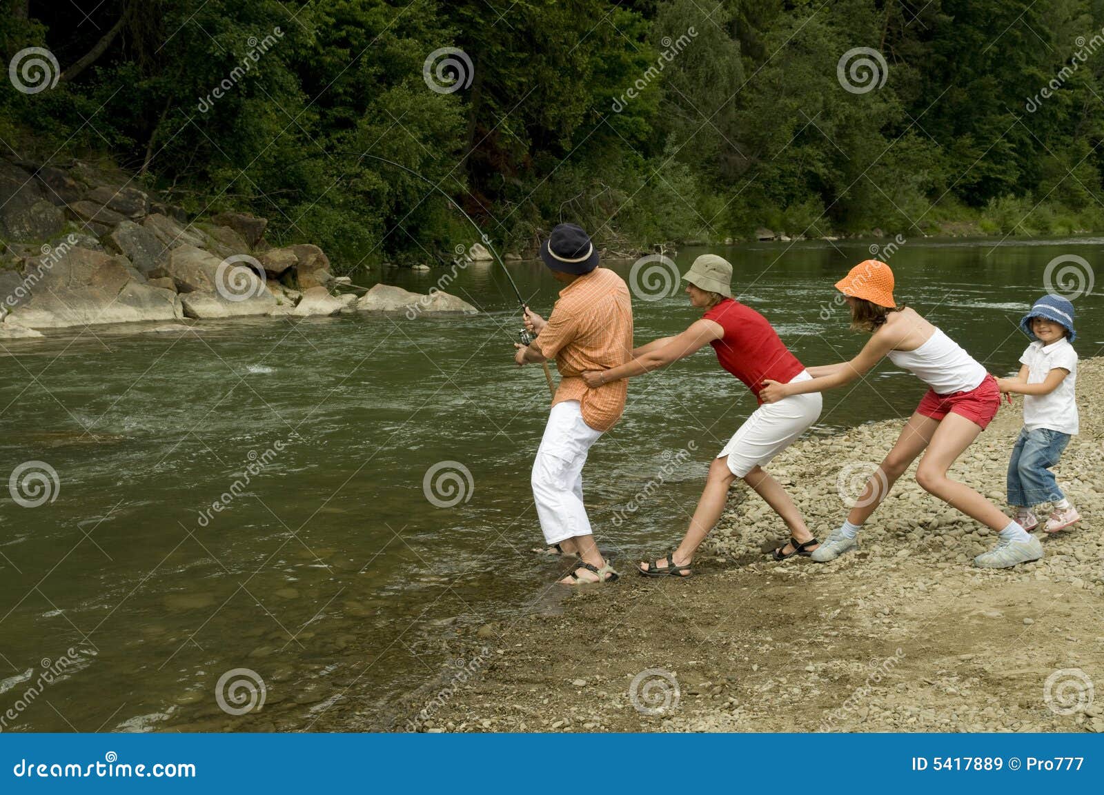 Family team fishing stock image. Image of hobby, happy - 5417889