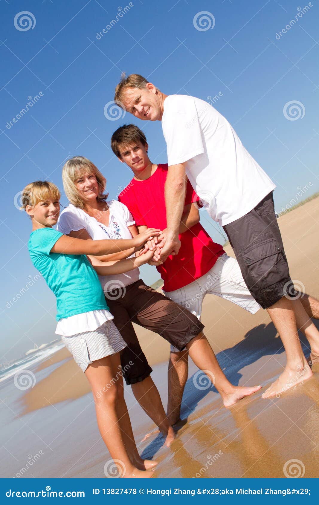Family teamwork stock photo. Image of four, beach, person - 13827478