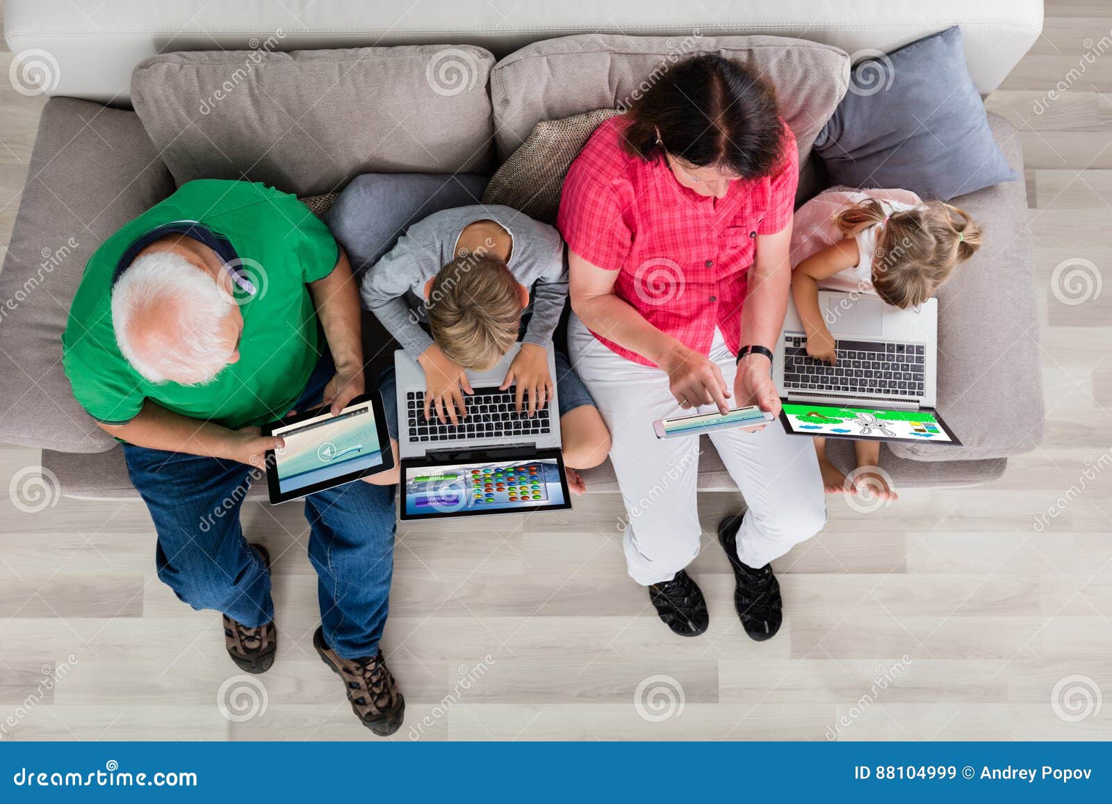 Family with Their Laptop and Digital Tablet at Home Stock Image - Image ...