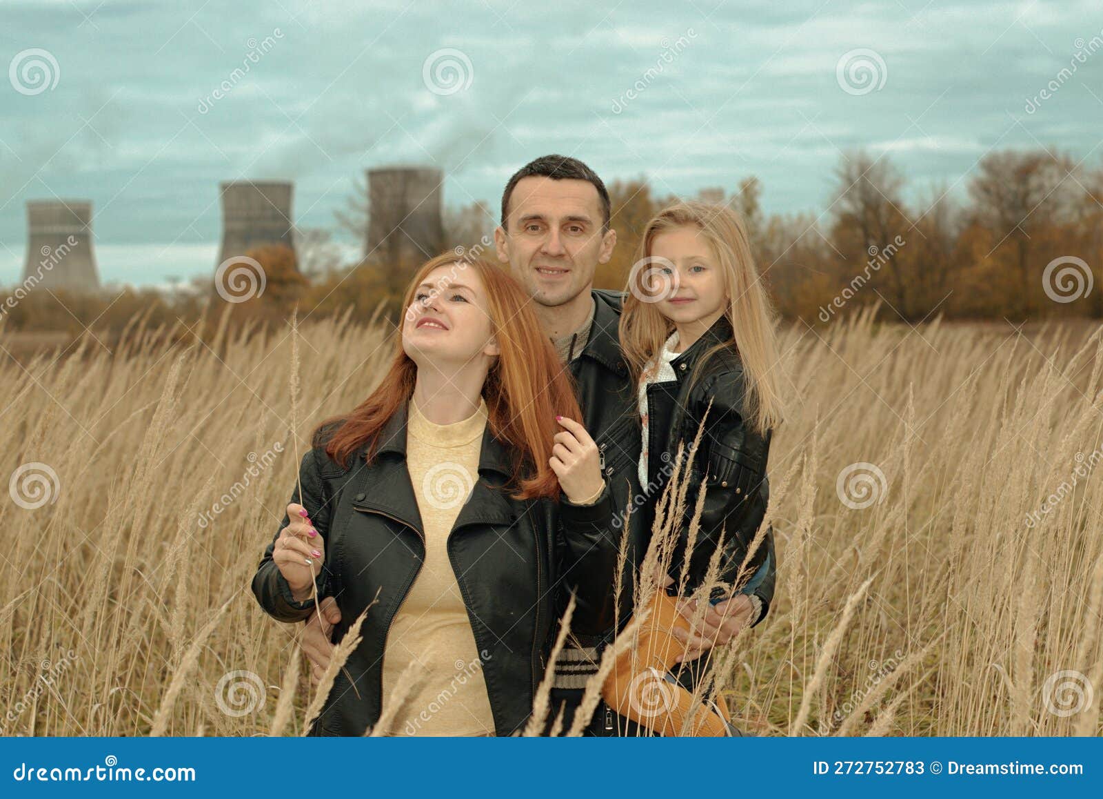 A Family of Three in Black Leather Jackets in a Field. Stock Image ...