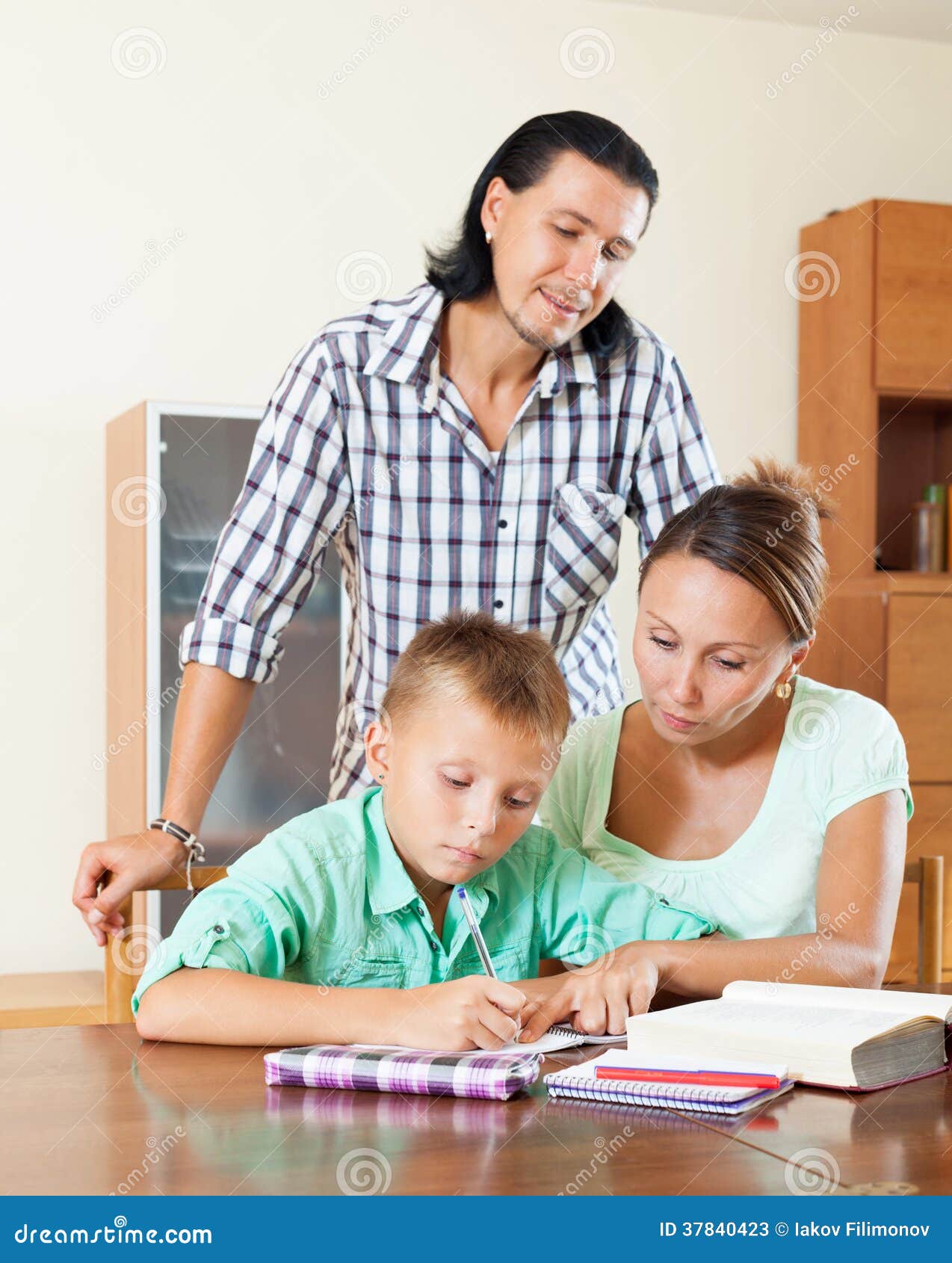 Family of Three Doing Homework in Home Interior Stock Image - Image of ...