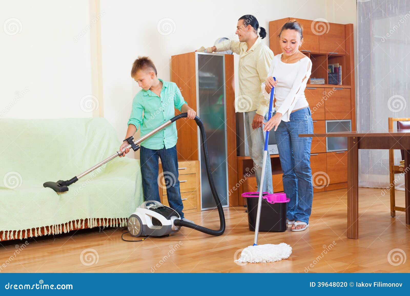 Family of Three Doing Housework Stock Photo - Image of assistance ...