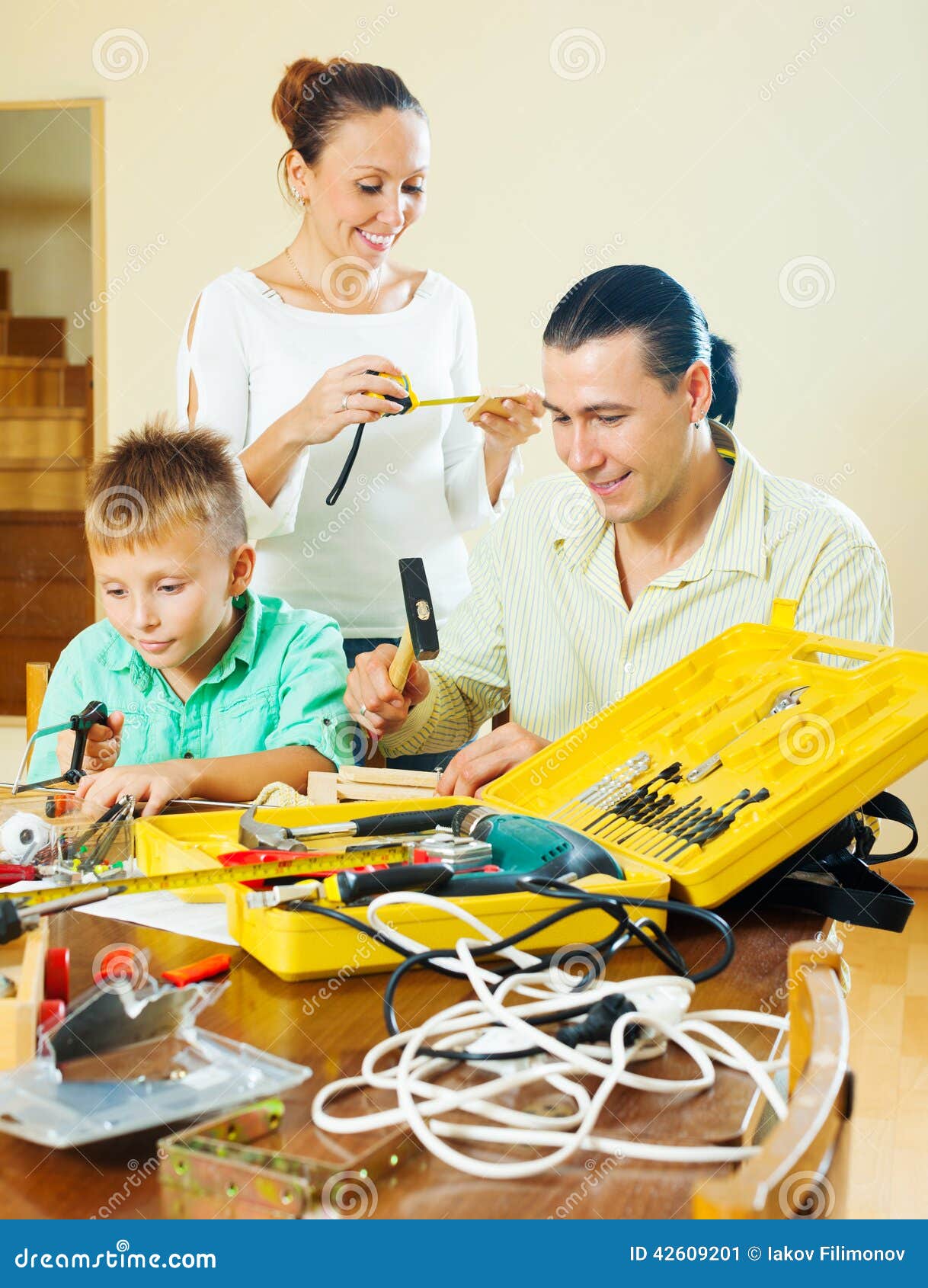 Family of Three Doing Something with the Working Tools Stock Image ...