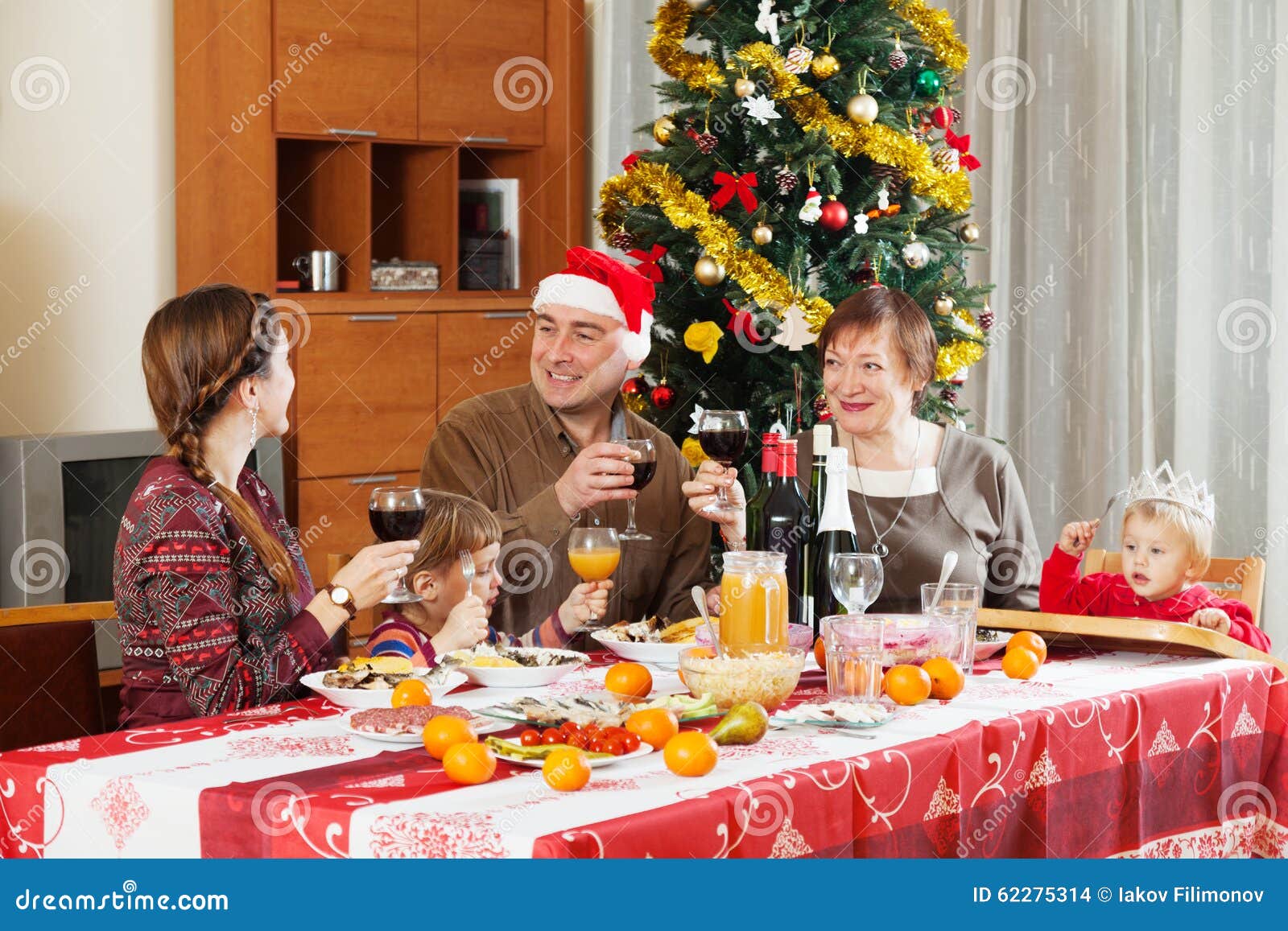 Family of Three Generations Around Festive Table Stock Photo - Image of ...