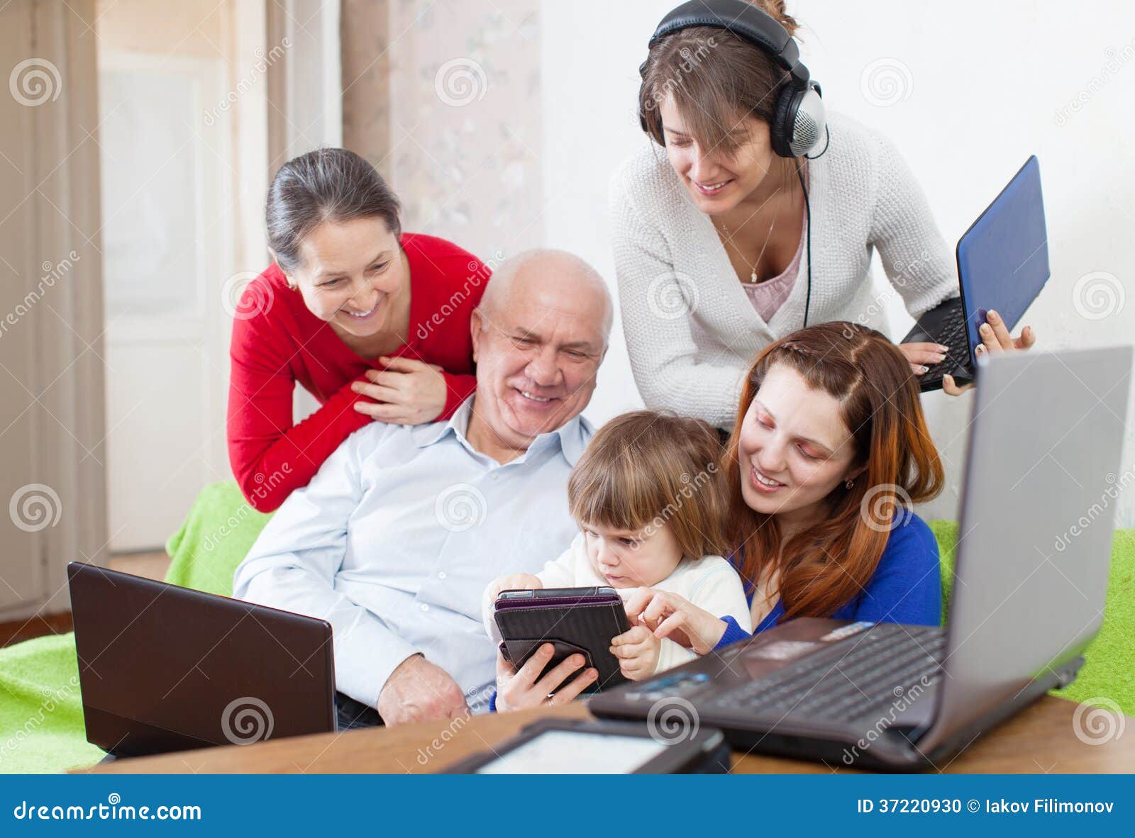 Family Of Three Generations Uses Few Various Electronic Device Stock ...