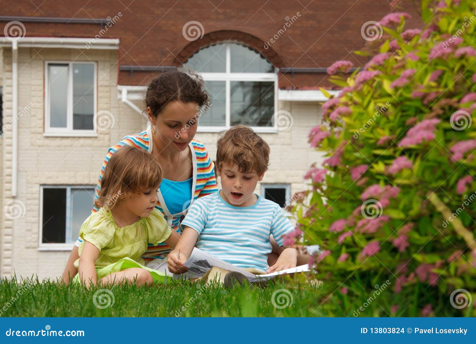 Family of Three People on Lawn in Front of House Stock Photo - Image of ...