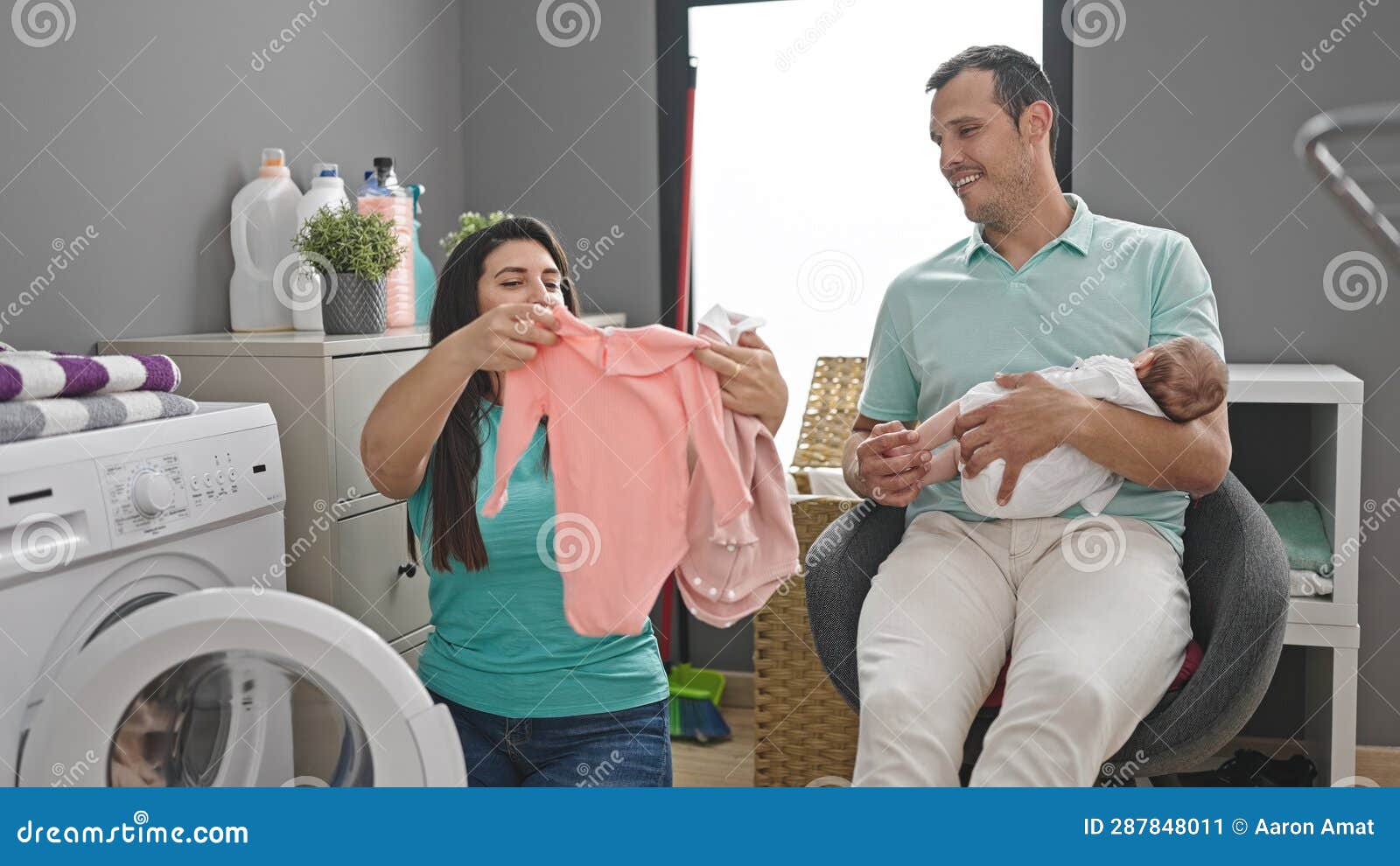 Family of Three Washing Clothes at Laundry Room Stock Image - Image of ...
