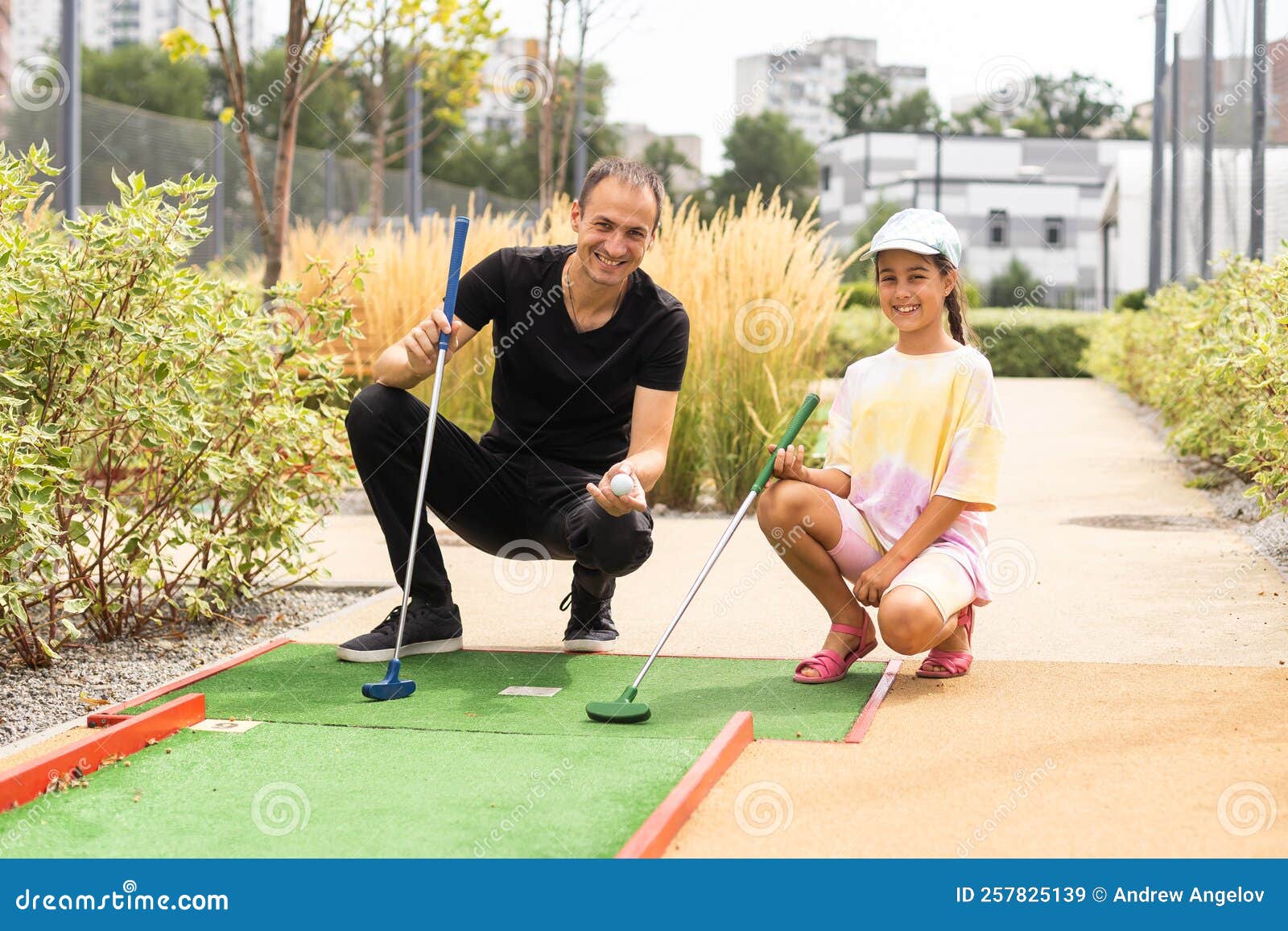 Family: Family Time Playing Mini-Golf in the Summer. Stock Image ...