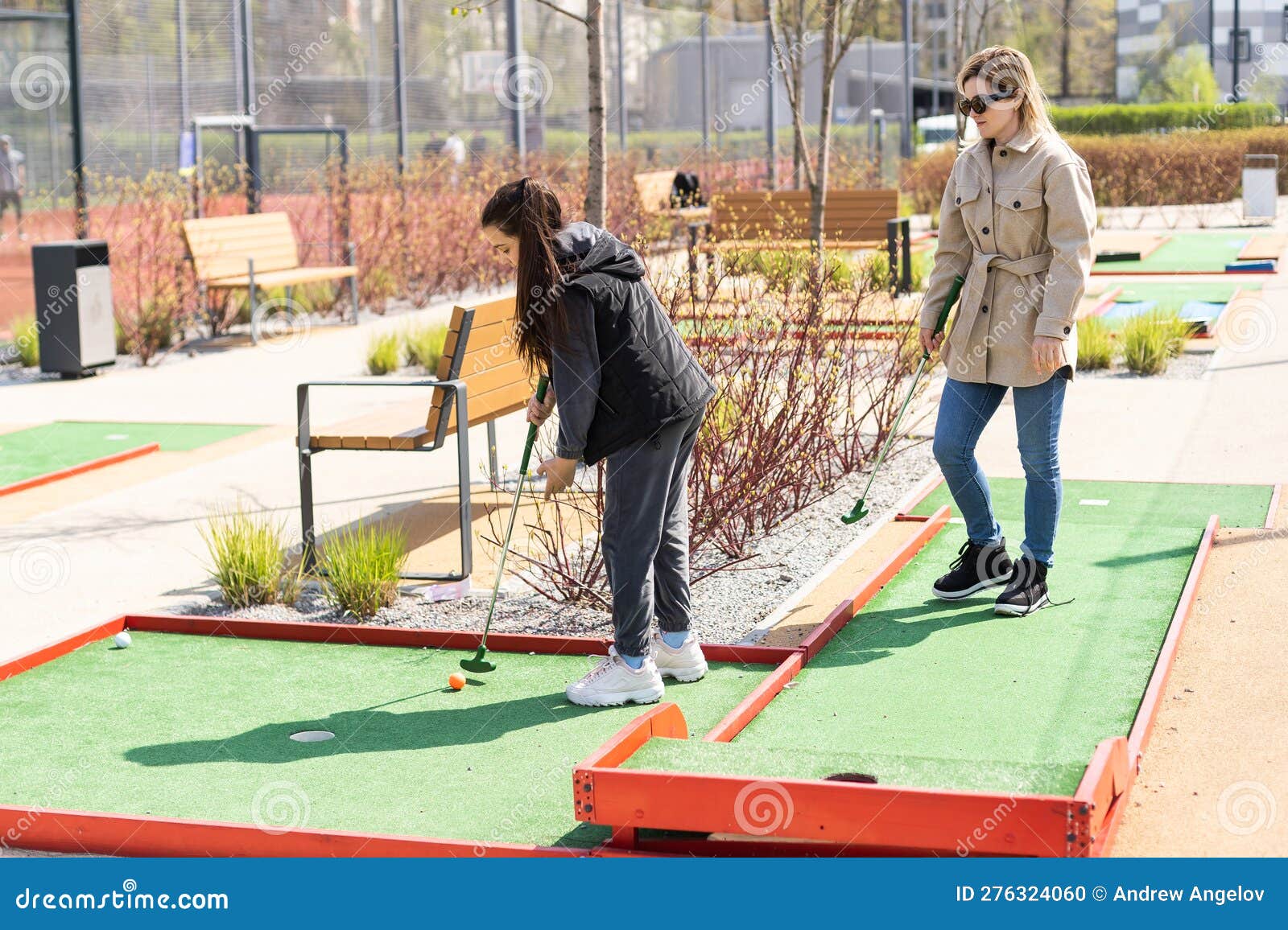 Family Time Playing Mini-Golf in the Summer Stock Photo - Image of vpub ...